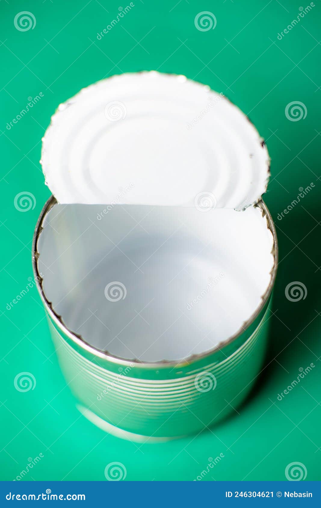 Open Empty Tin Can on a Green Background Stock Image - Image of empty ...