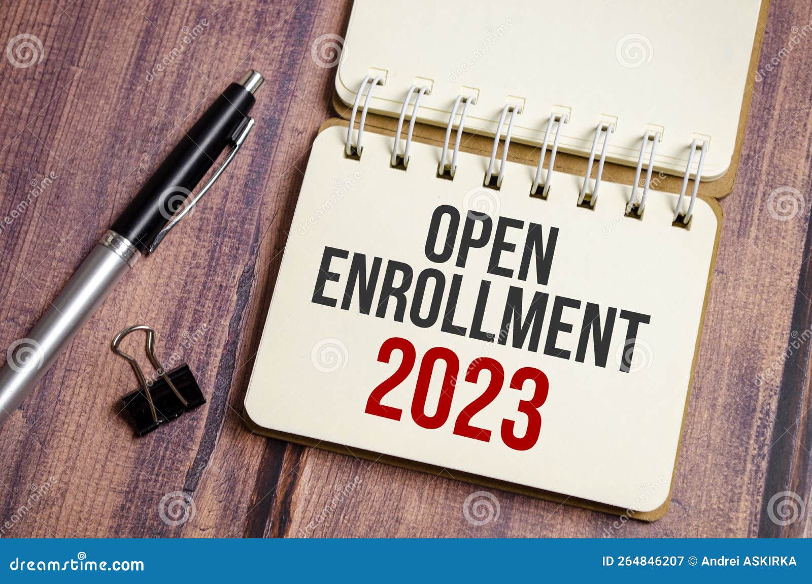 OPEN ENROLLMENT 2023 Words on Notebook with Pen and Clips Stock Image ...