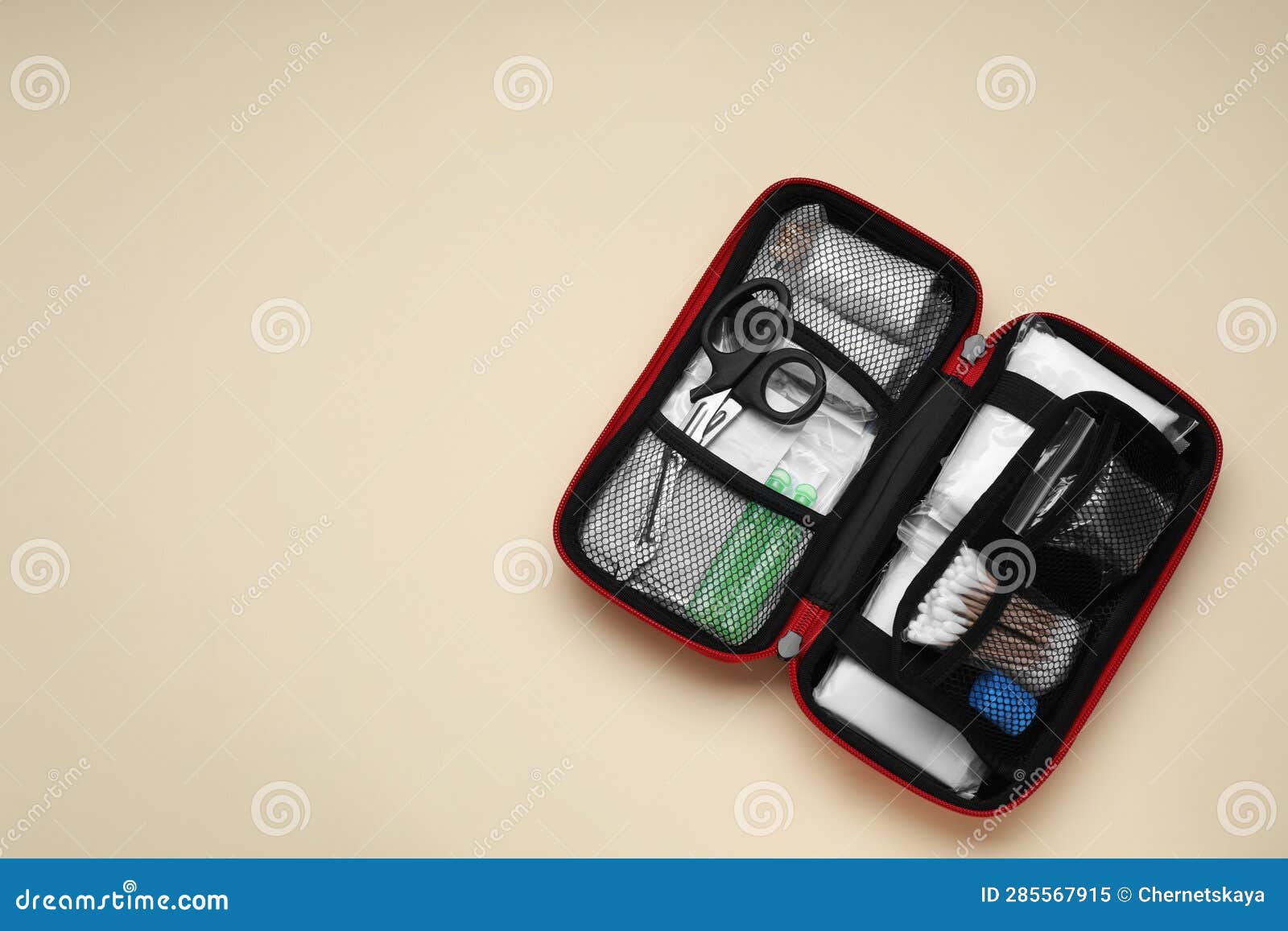 Open First Aid Kit on Beige Background, Top View. Space for Text Stock ...