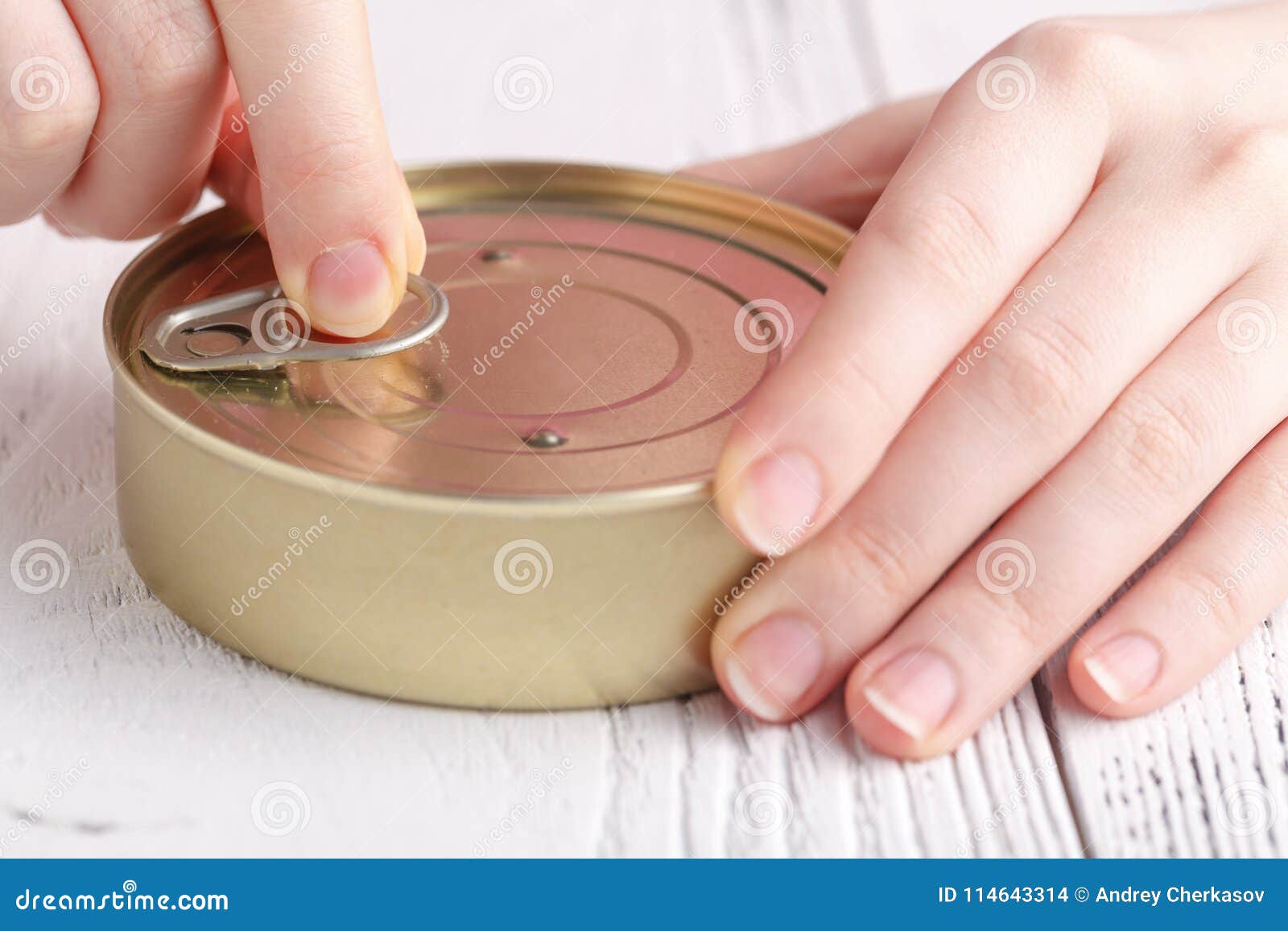 Open Fish Can with Hands and Fork on Table Stock Photo - Image of ...