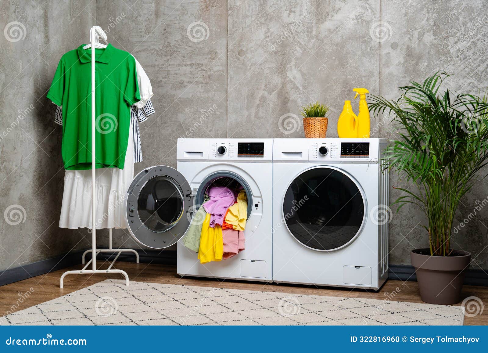 Open Front Loading Washing Machine with Colorful Clothes Stock Photo ...