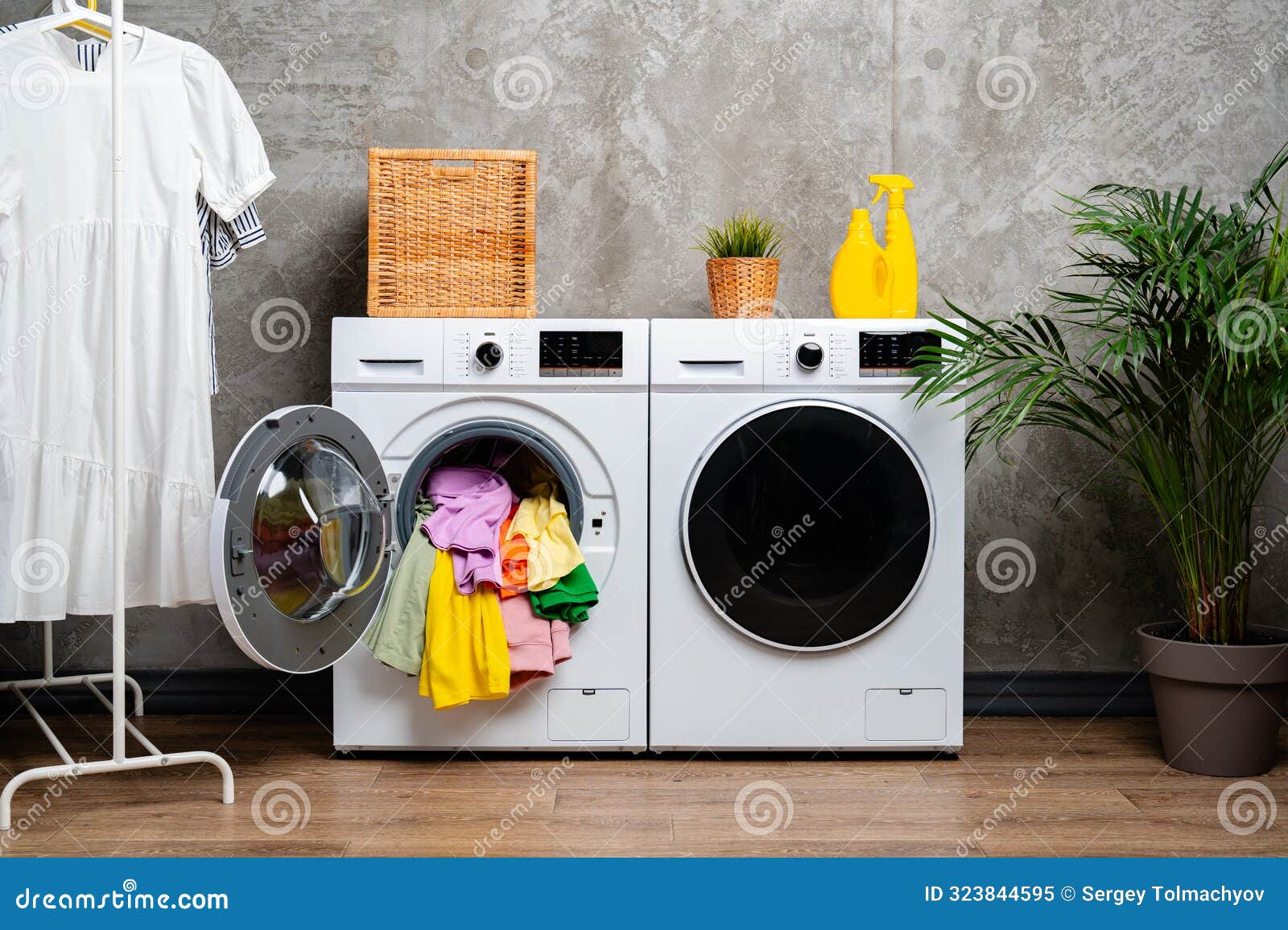 Open Front Loading Washing Machine with Colorful Clothes Stock Image ...