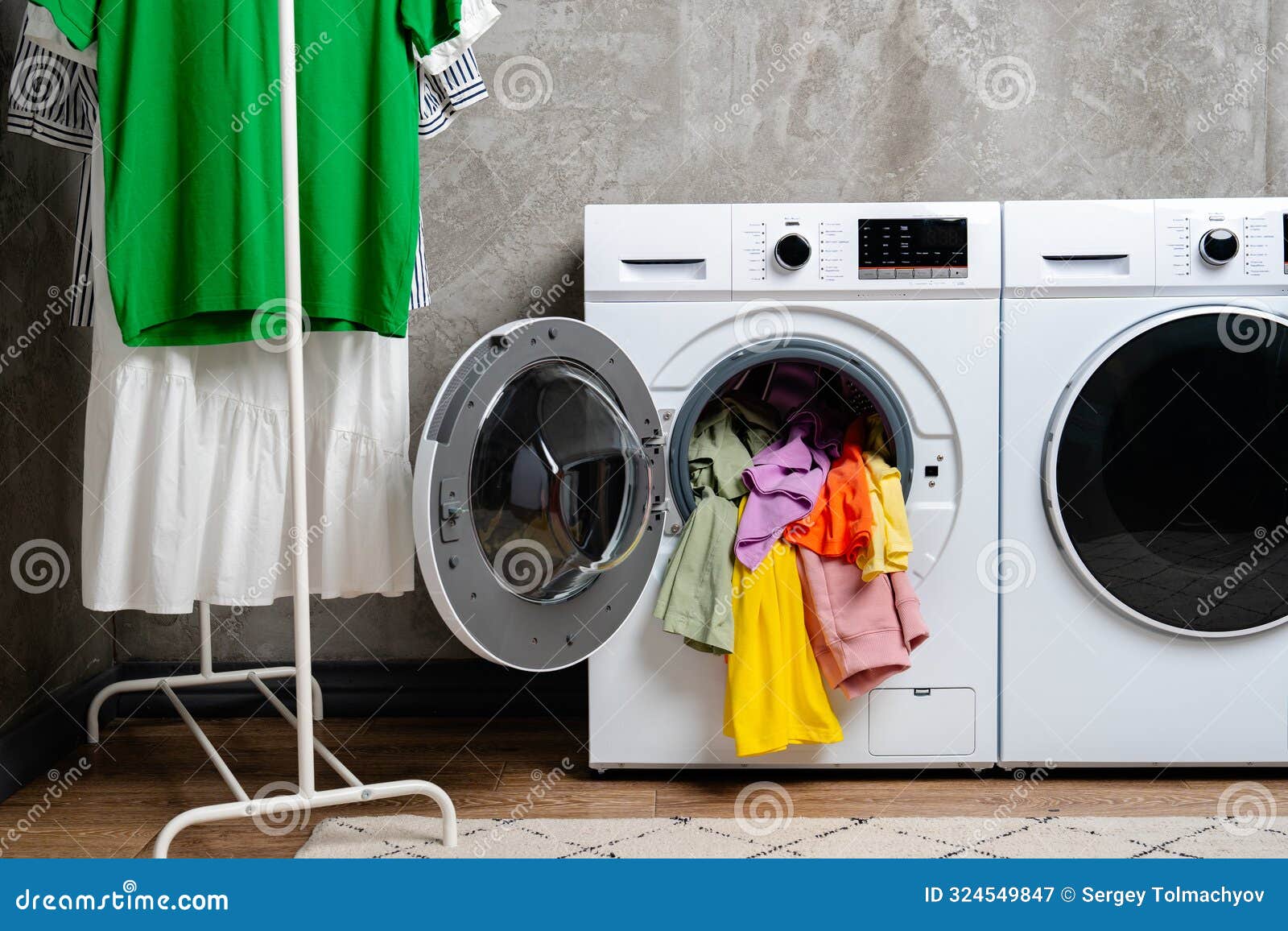Open Front Loading Washing Machine with Colorful Clothes Stock Image ...