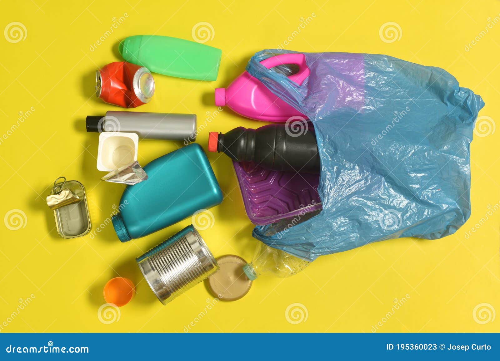 Open Garbage Bag with Plastic Bottles and Can Scattered on Yellow ...