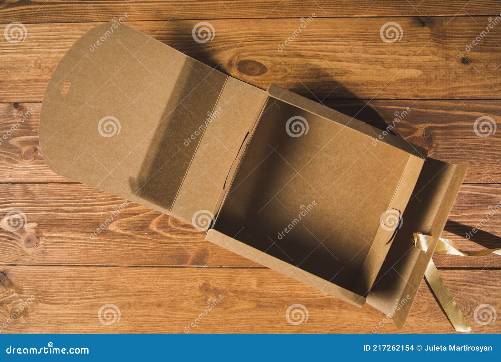 Open gift box on the table stock photo. Image of paper - 217262154