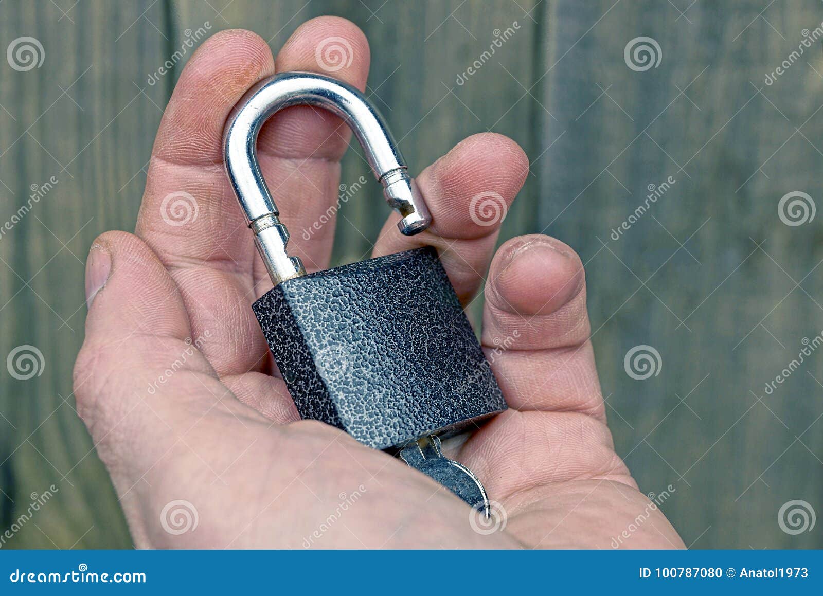 An Open Gray Padlock with a Key on the Open Palm Stock Photo - Image of ...