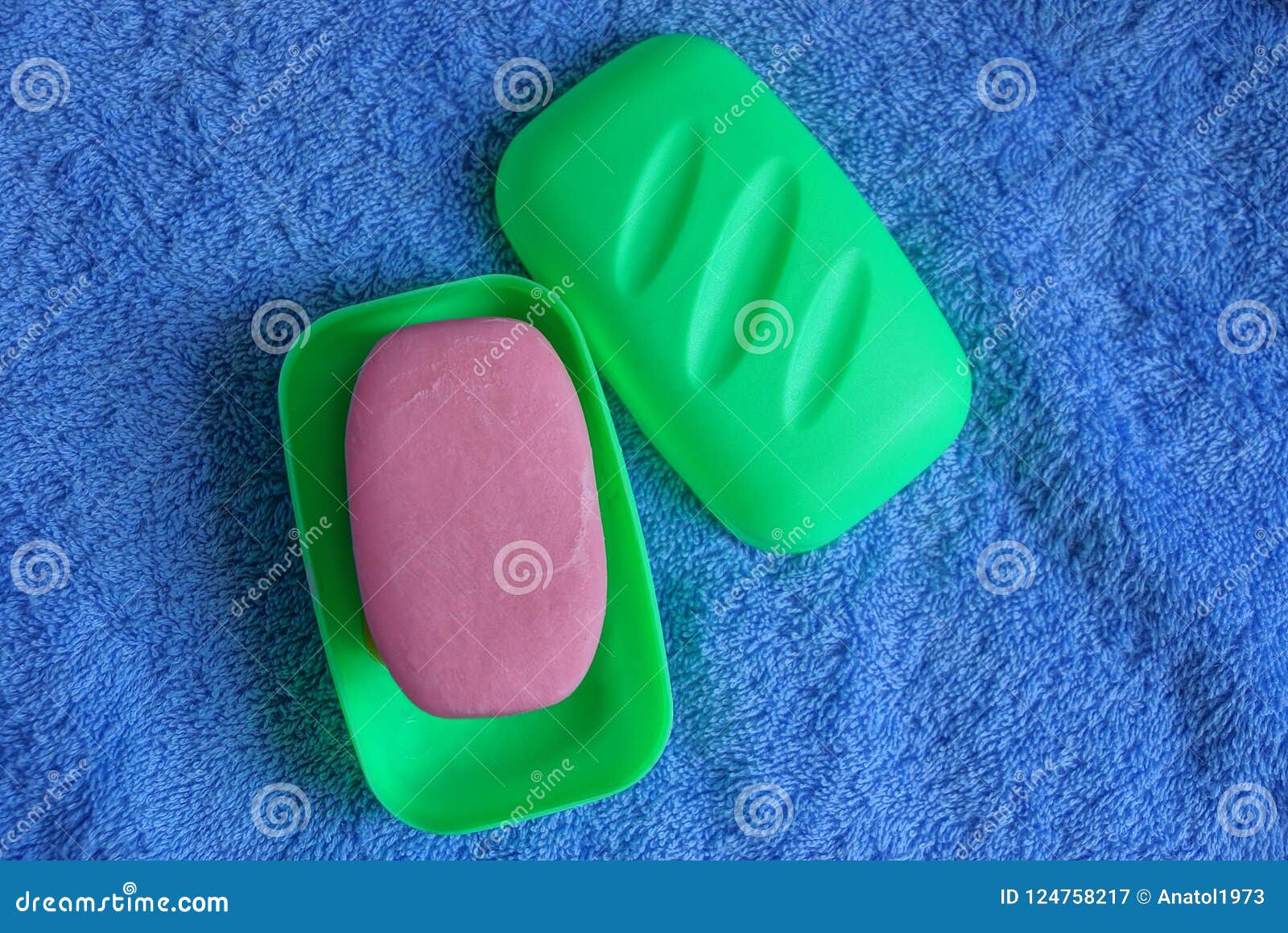 Green Plastic Soap Dish with Red Soap on Blue Cloth Towels Stock Image ...