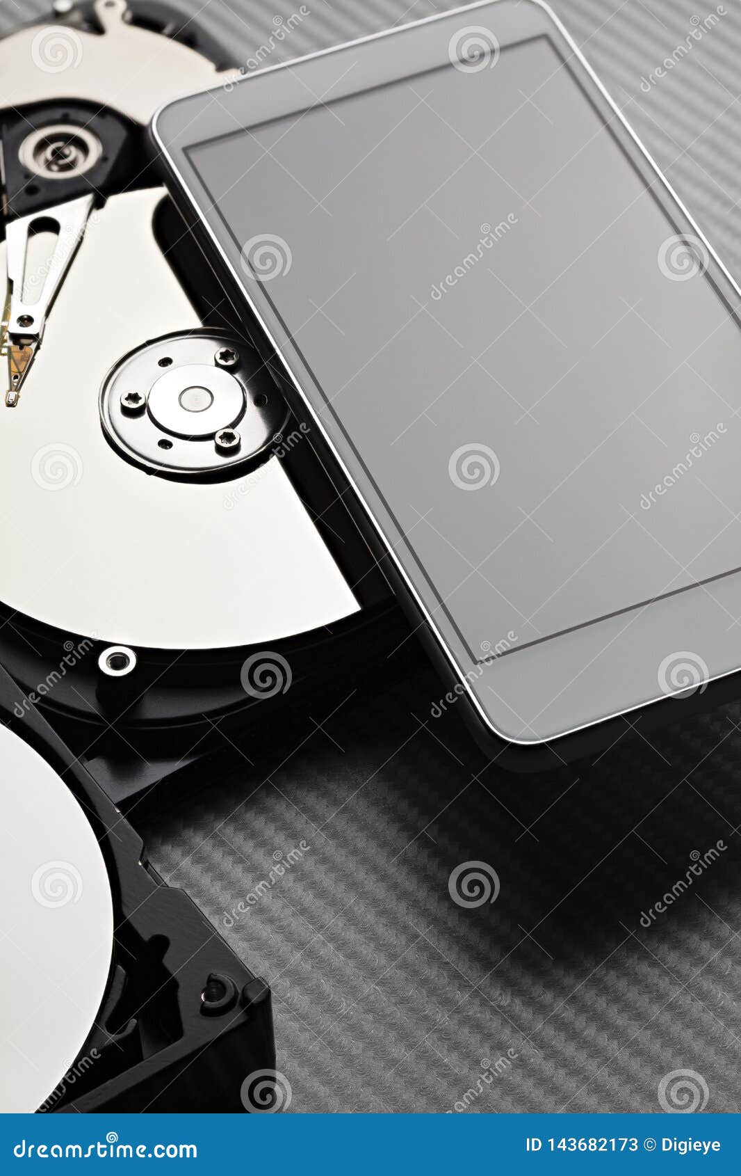 Open Hard Disk Drive with Silver Plate and Cell Phone on Carbon Fiber ...
