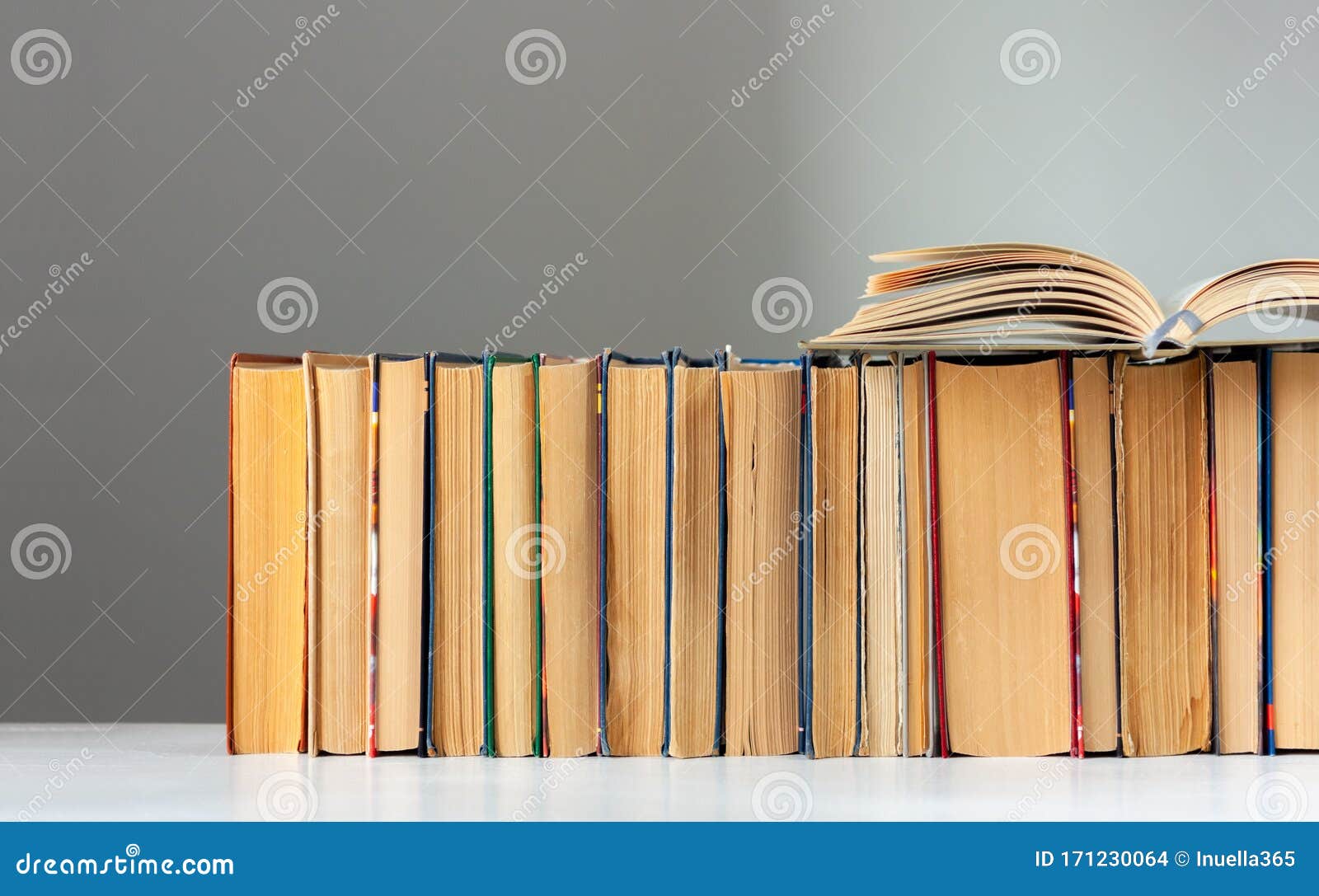 Open Hardback Book, Diary, Fanned Pages on Stack of Books on White ...