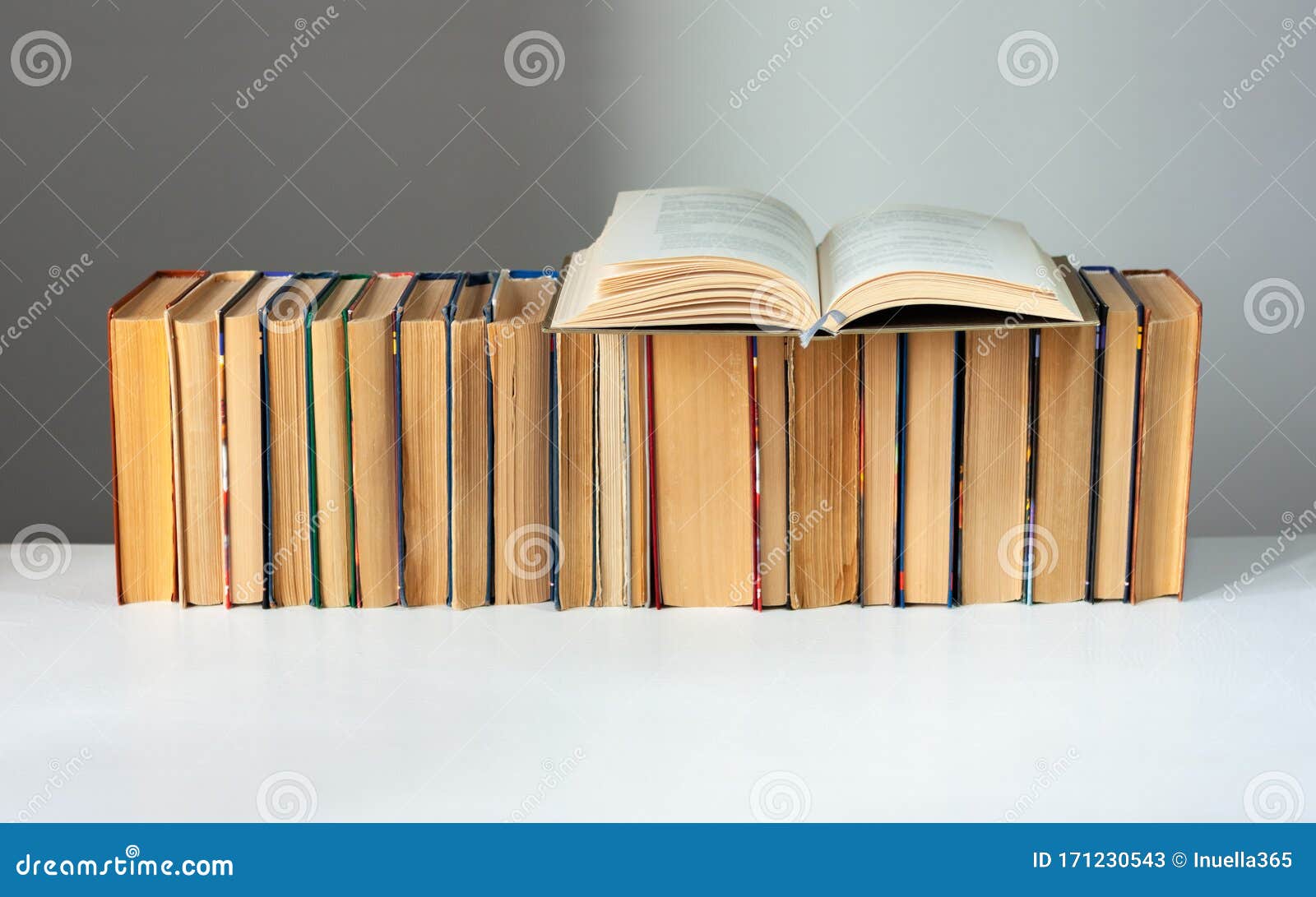 Open Hardback Book, Diary, Fanned Pages on Stack of Books on White ...