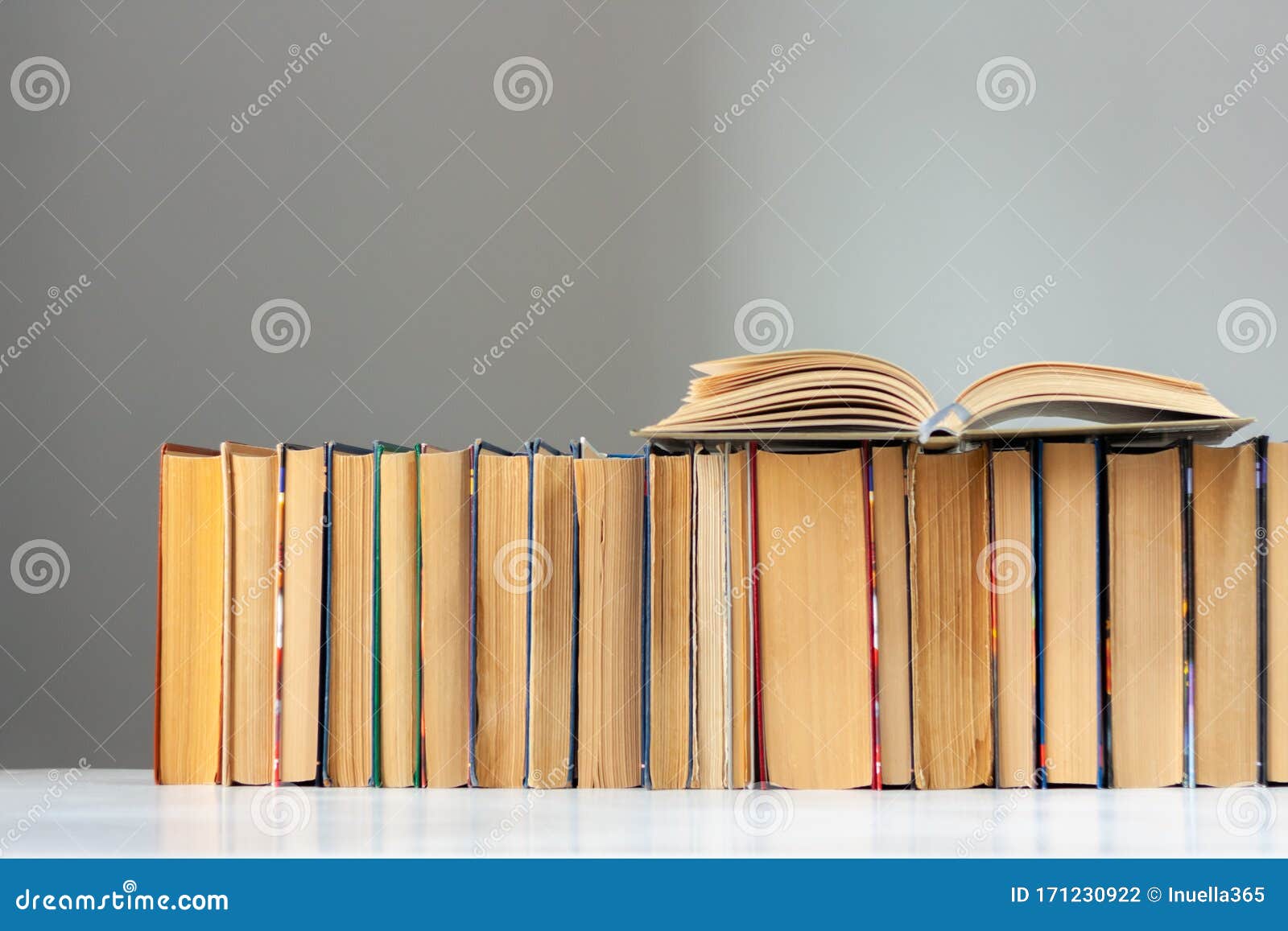 Open Hardback Book, Diary, Fanned Pages on Stack of Books on White ...