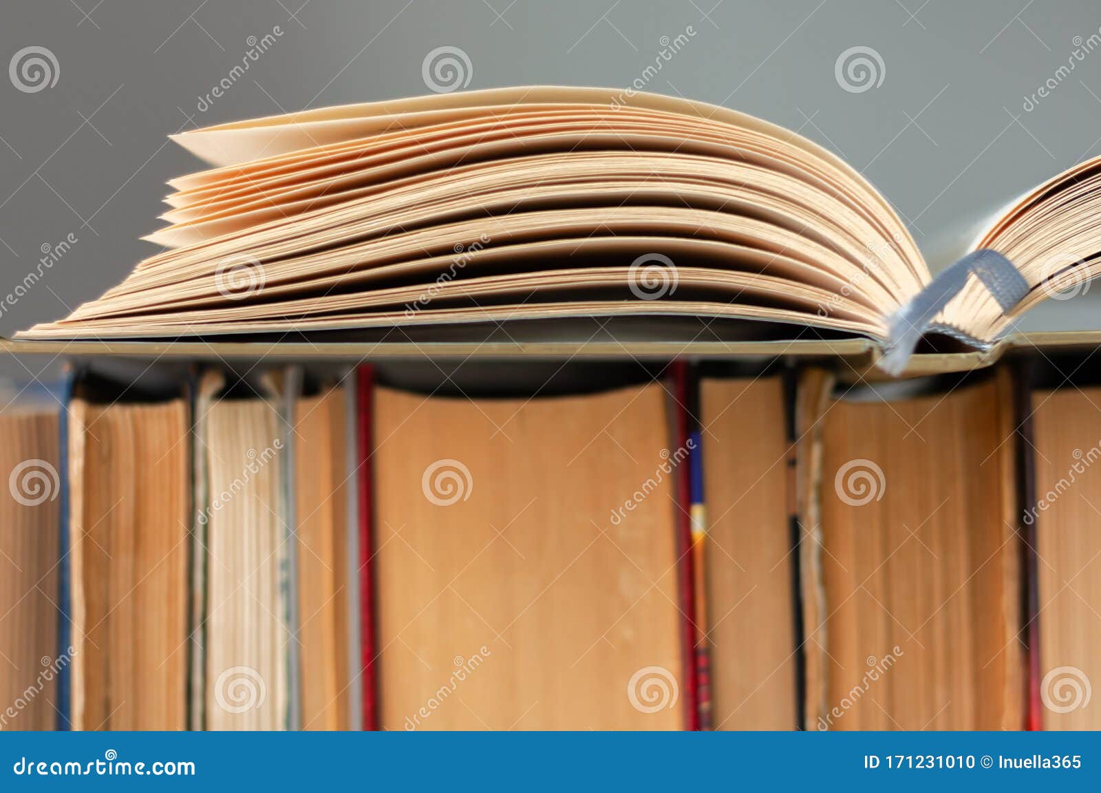 Open Hardback Book, Diary, Fanned Pages on Stack of Books on White ...