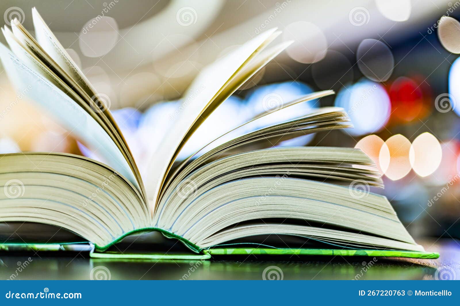 An Open Hardcover Book on a Table in a Public Library Stock Image ...