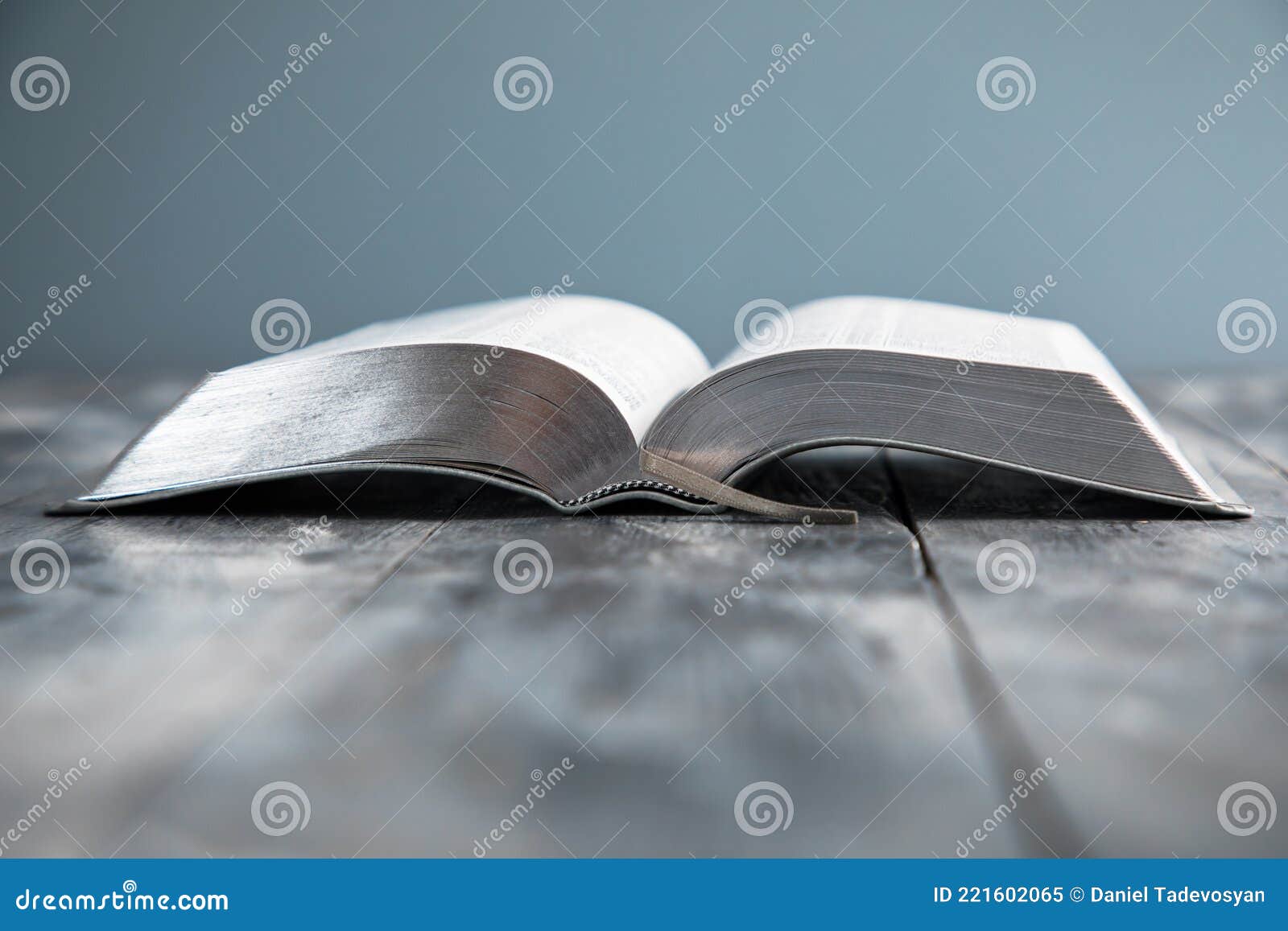 Open Holy Bible on table stock image. Image of bible - 221602065
