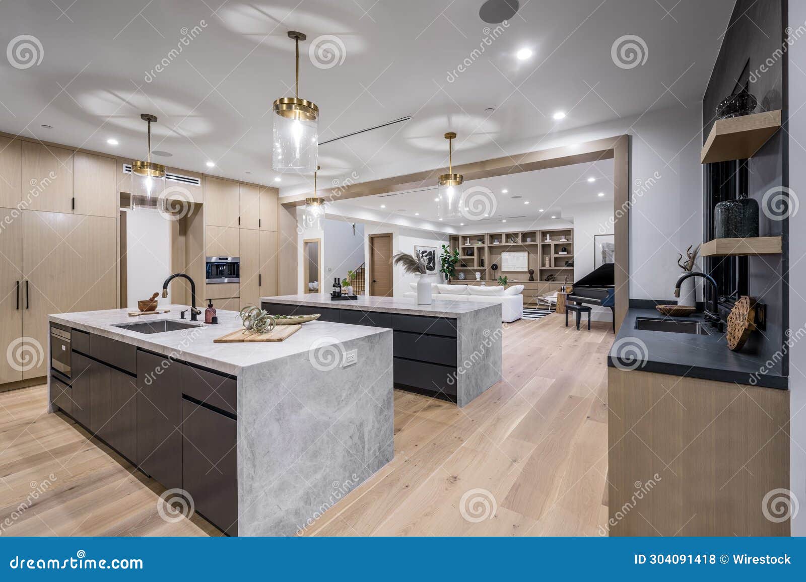 An Open Kitchen with White and Black Counters Top and Dark Cupboards Editorial Stock Photo ...