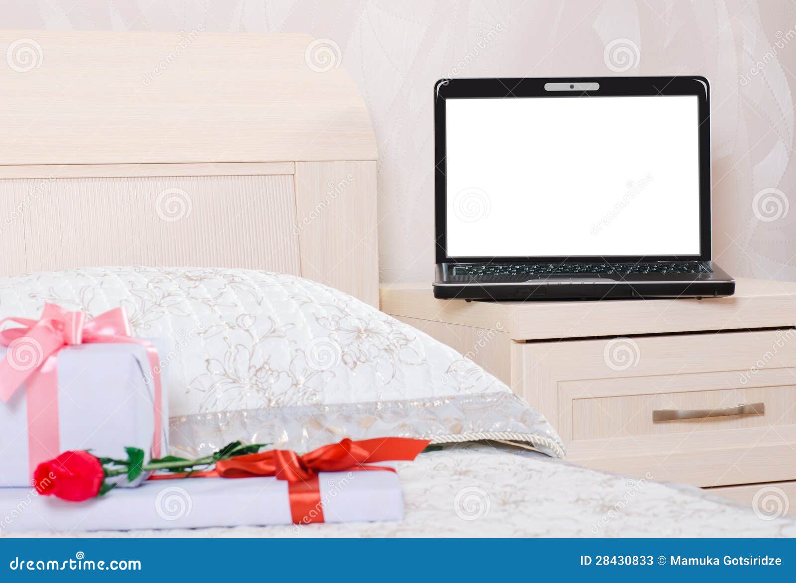 Open Laptop with a Blank Screen is on the Nightstand in the Bedroom ...