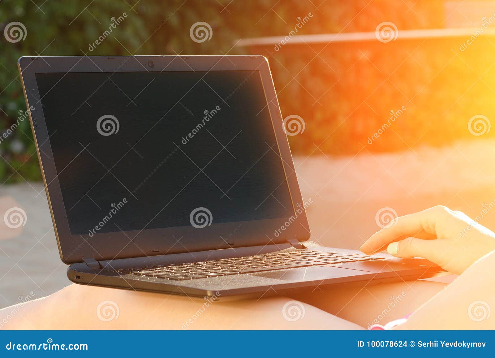 Open Laptop on Female Lap. Outdoors, Sunlight Stock Photo - Image of ...