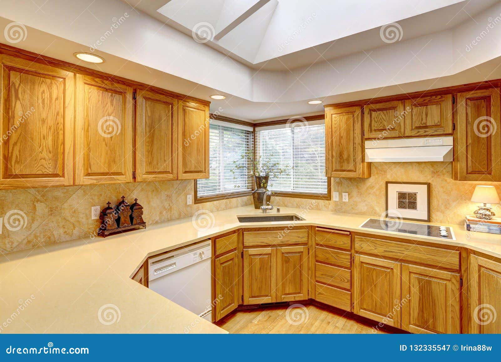 Open Large Kitchen Interior with Vaulted Ceiling and White Appliances ...