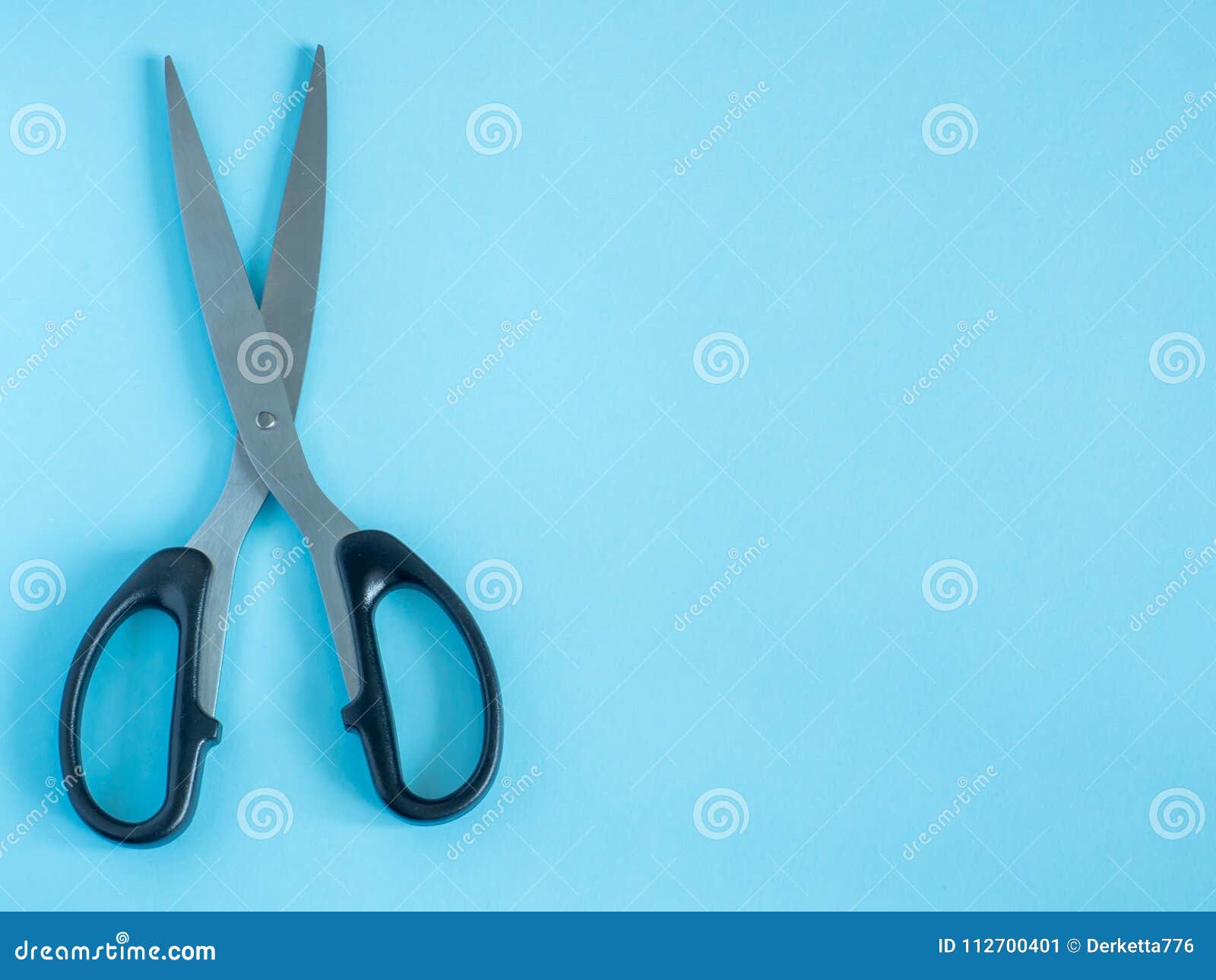 Open a Large Pair of Scissors on a Blue Background Stock Image - Image ...