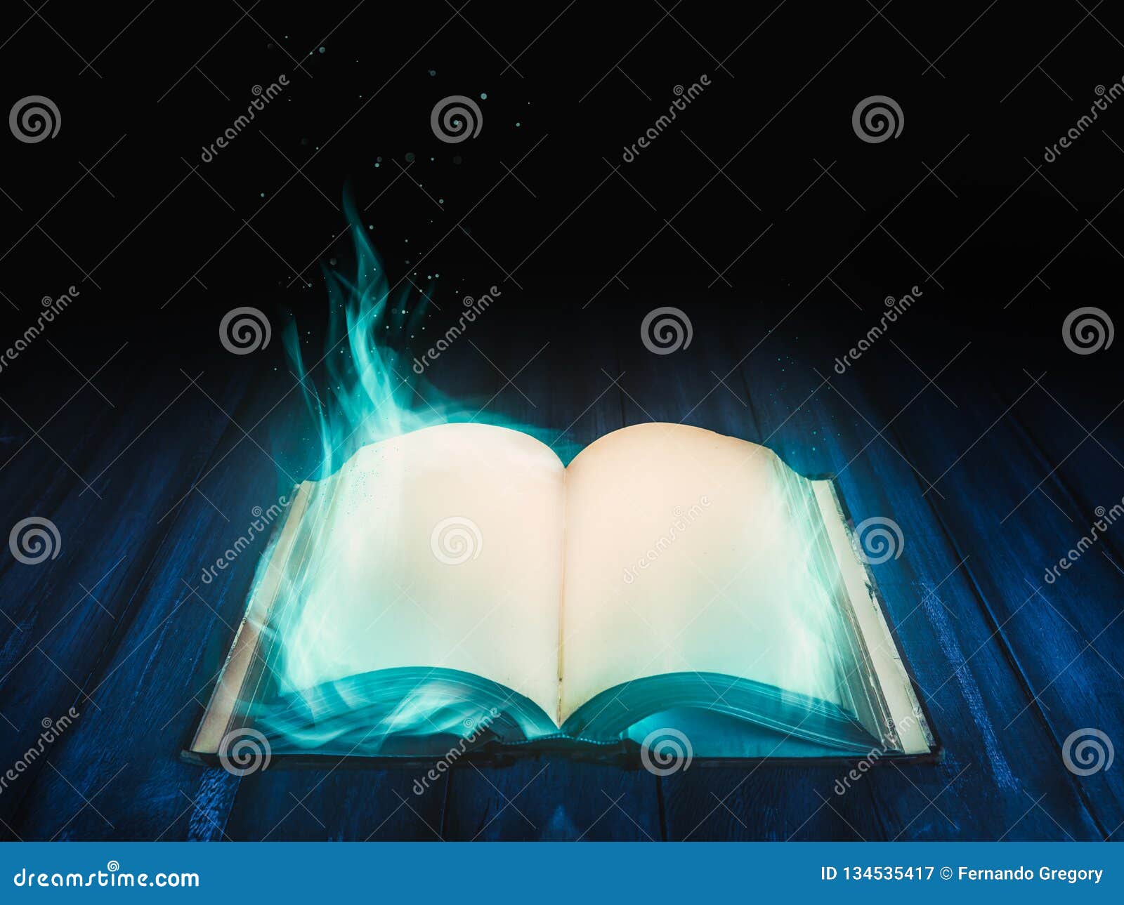 Open magic book on. atable stock image. Image of bright - 134535417