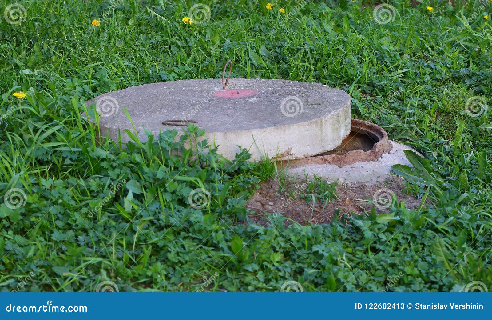 Manhole in the grass stock image. Image of lawn, grass - 122602413