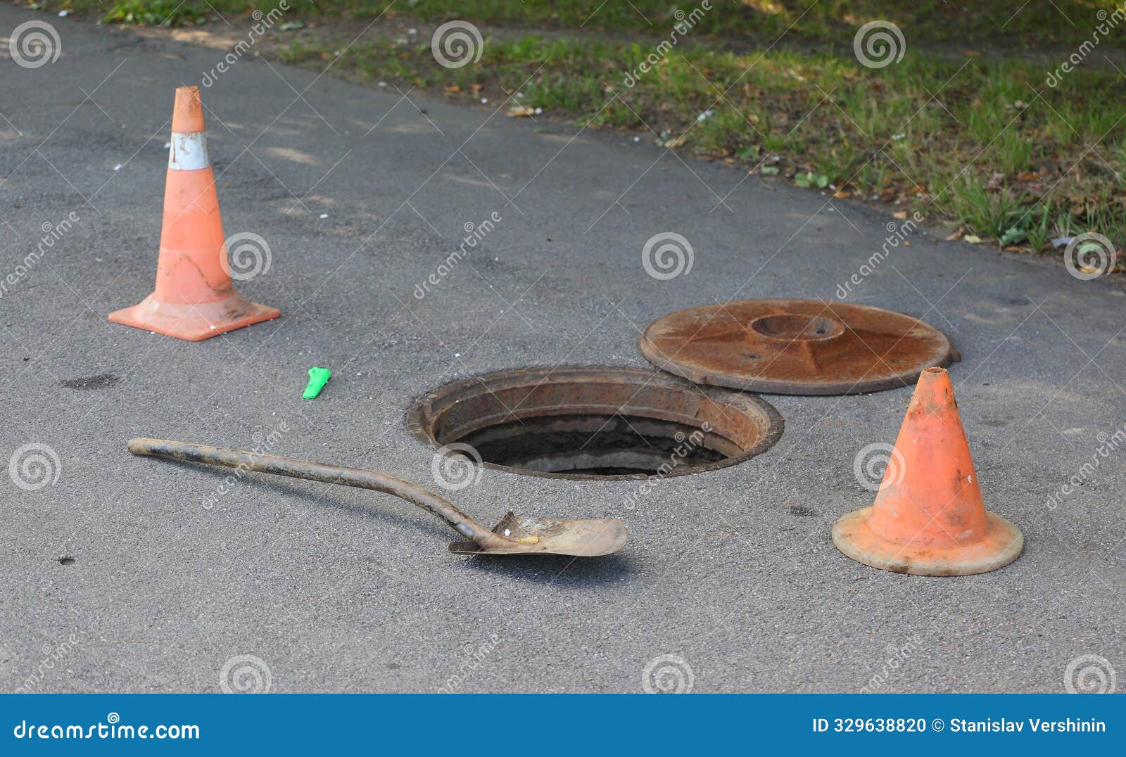 An Open Manhole Protected by Restrictive Cones Stock Photo - Image of ...