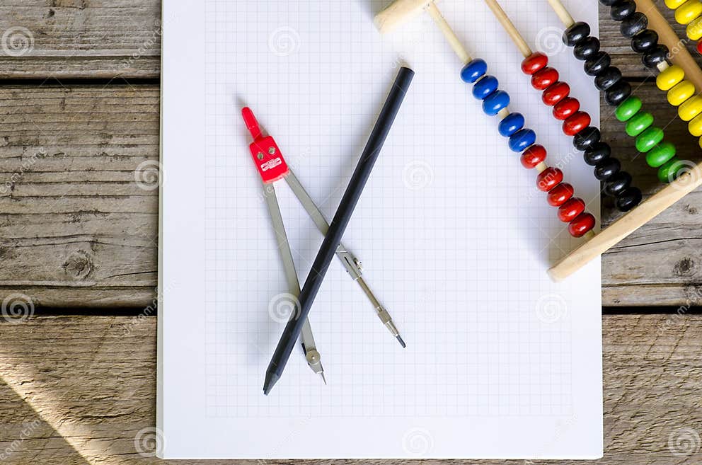 Open Math Notebook with Colored Counting Abacus and Steel Compass and ...