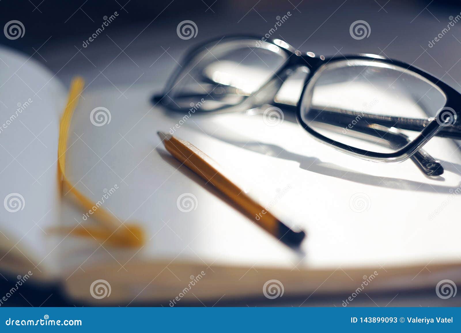 On an Open Notebook are Glasses and a Pencil Stock Image - Image of ...