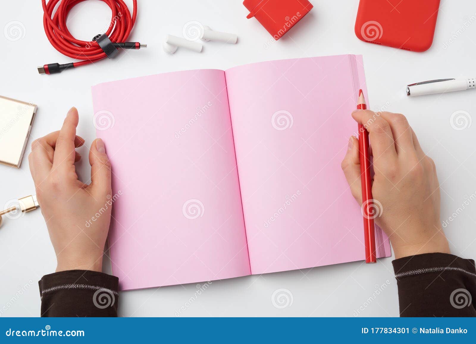 Open Notebook with Blank Pink Pages and Two Hands, Concept of Writing a ...
