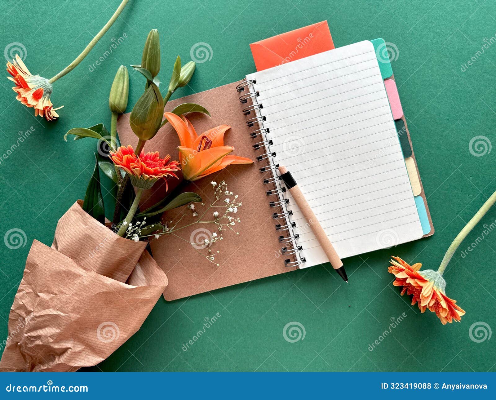 Open Notebook with Pen and Flowers on Green Background - Creative ...