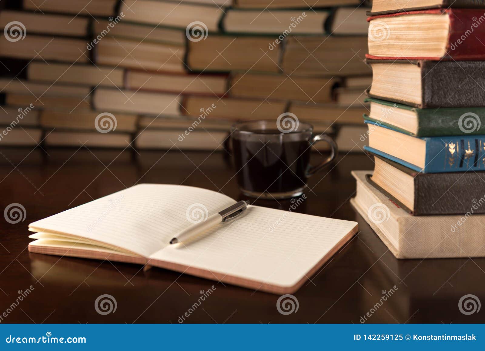Open Notebook on the Table, on the Background of Books Stock Image ...