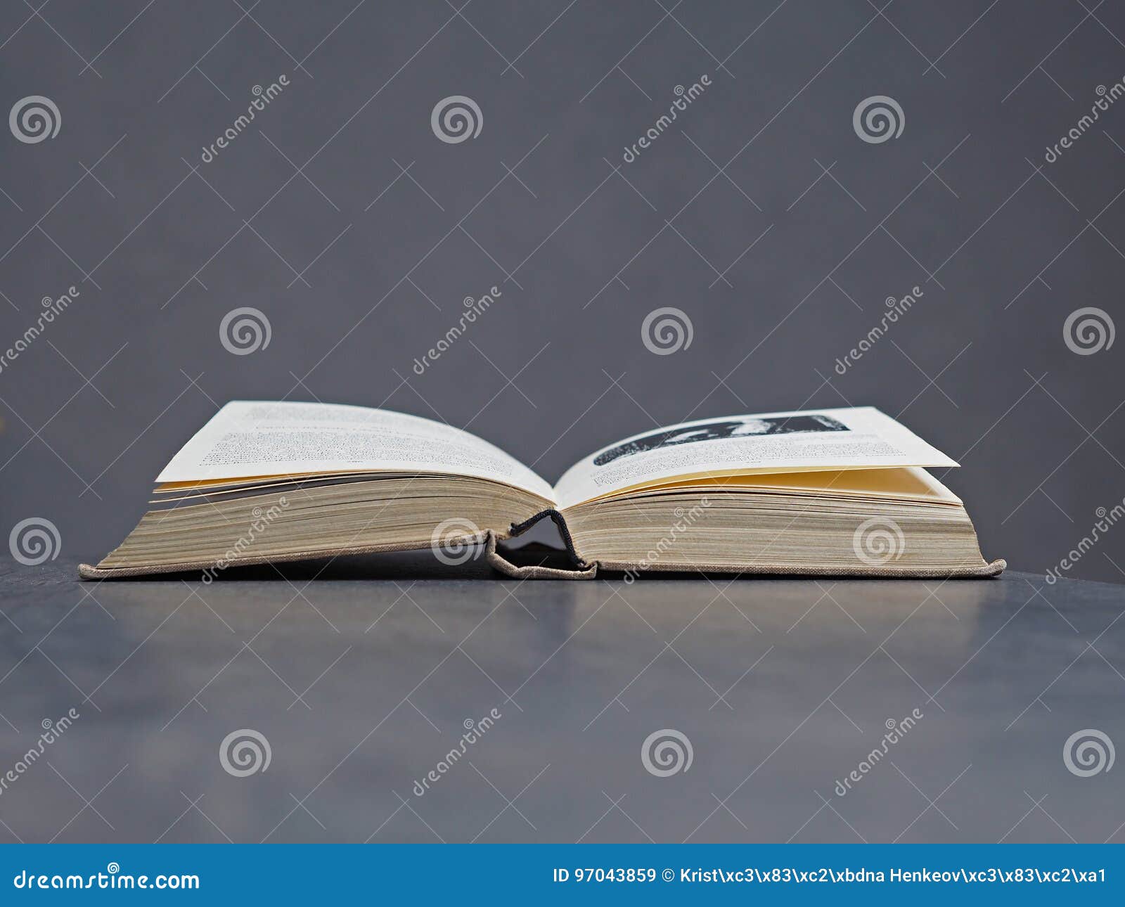 Open Old Book with Beige Canvas Binding, Soft Grey Background Stock ...