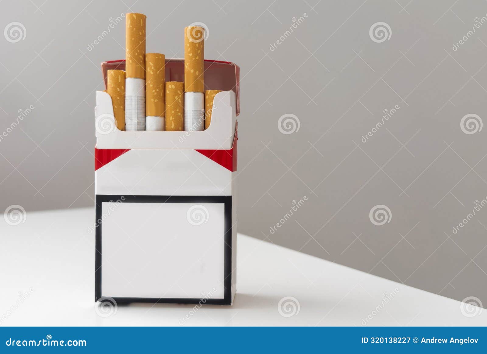 Open Pack of Cigarettes and a Cigarette on a White Background. Stock ...