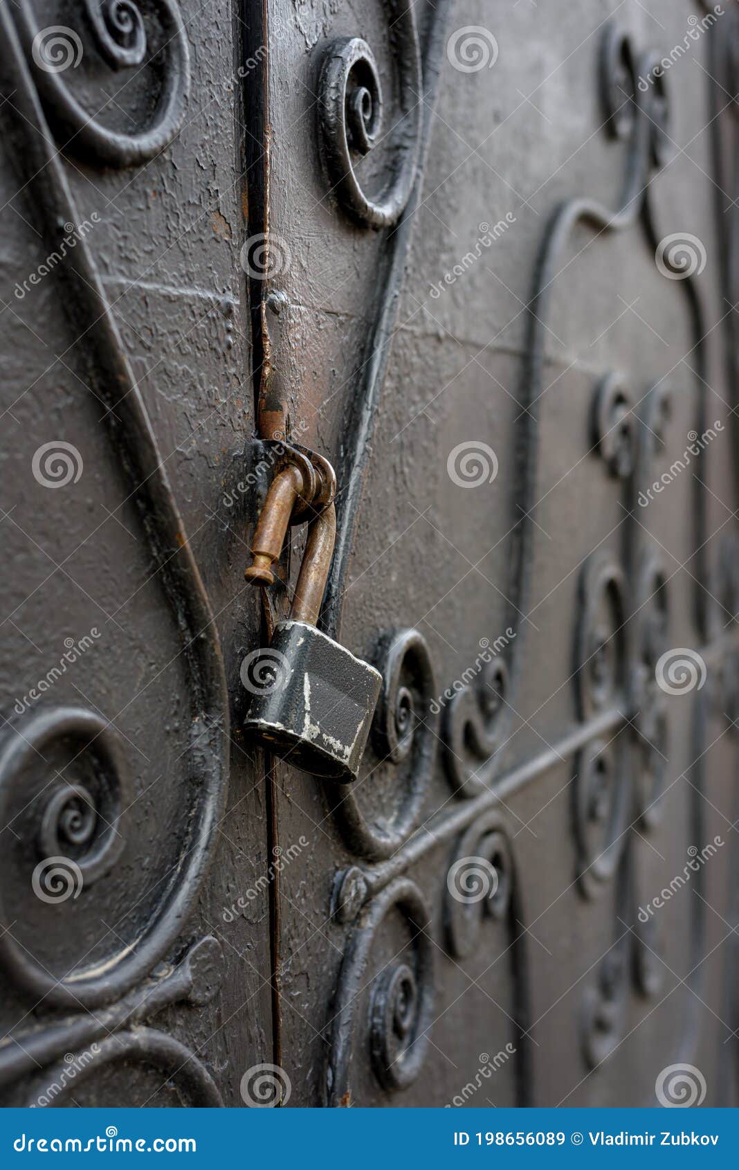 Padlock on an iron gate stock image. Image of grunge - 198656089