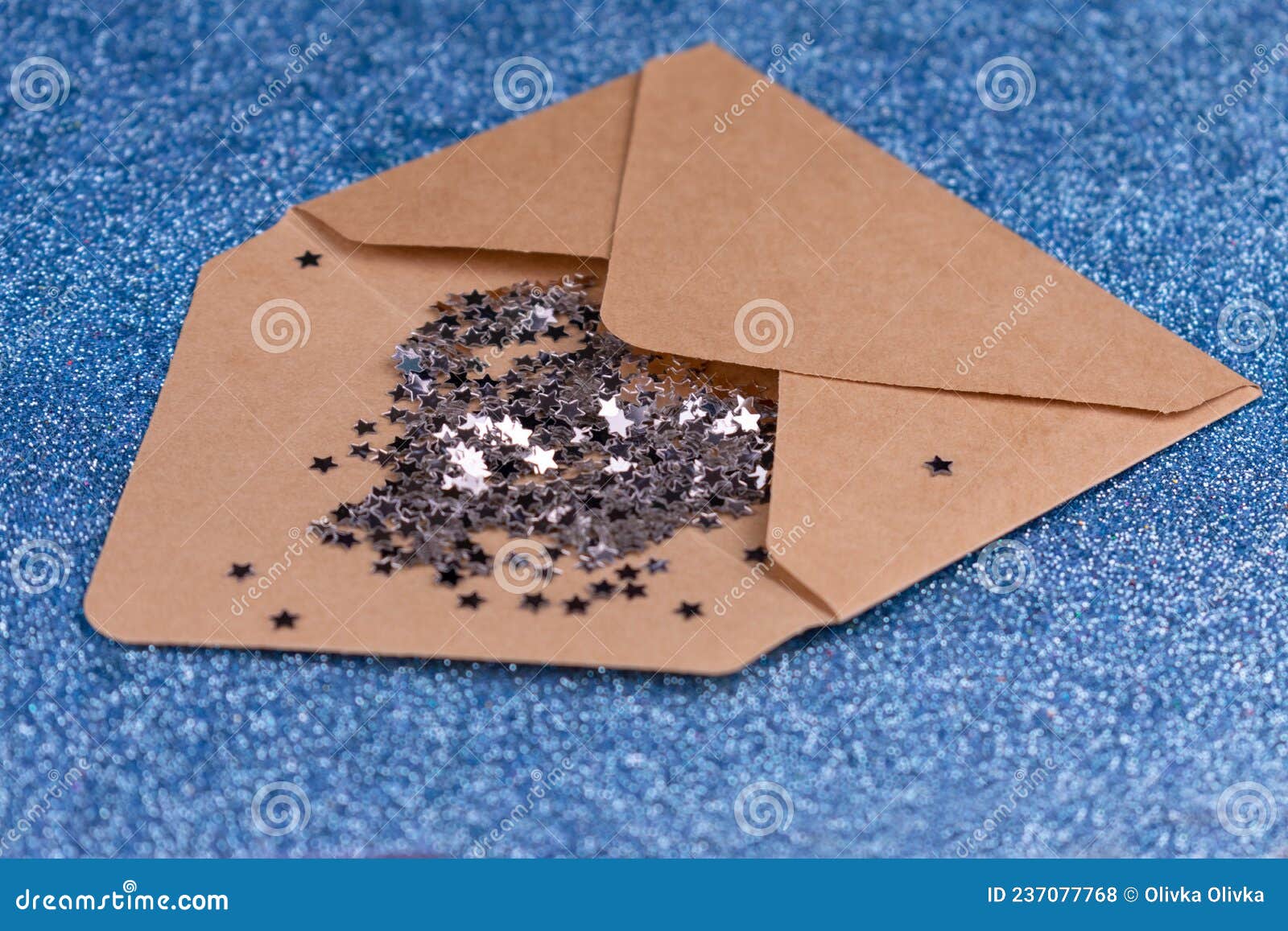 Open Paper Envelope with Shining Stars on Blue Background Stock Photo ...