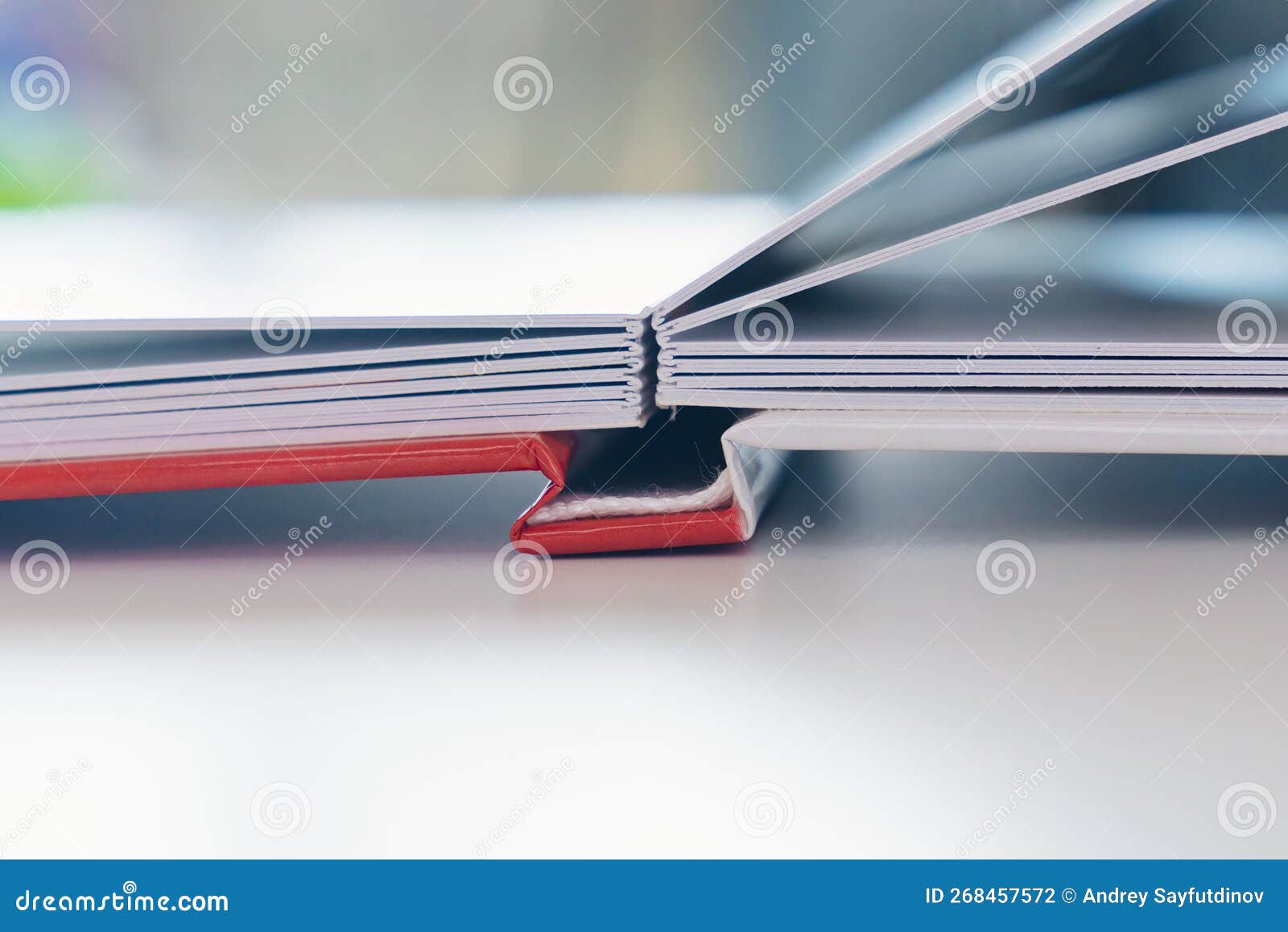 The Open Photobook Binding with Plastic Pages on a White Table. Stock ...