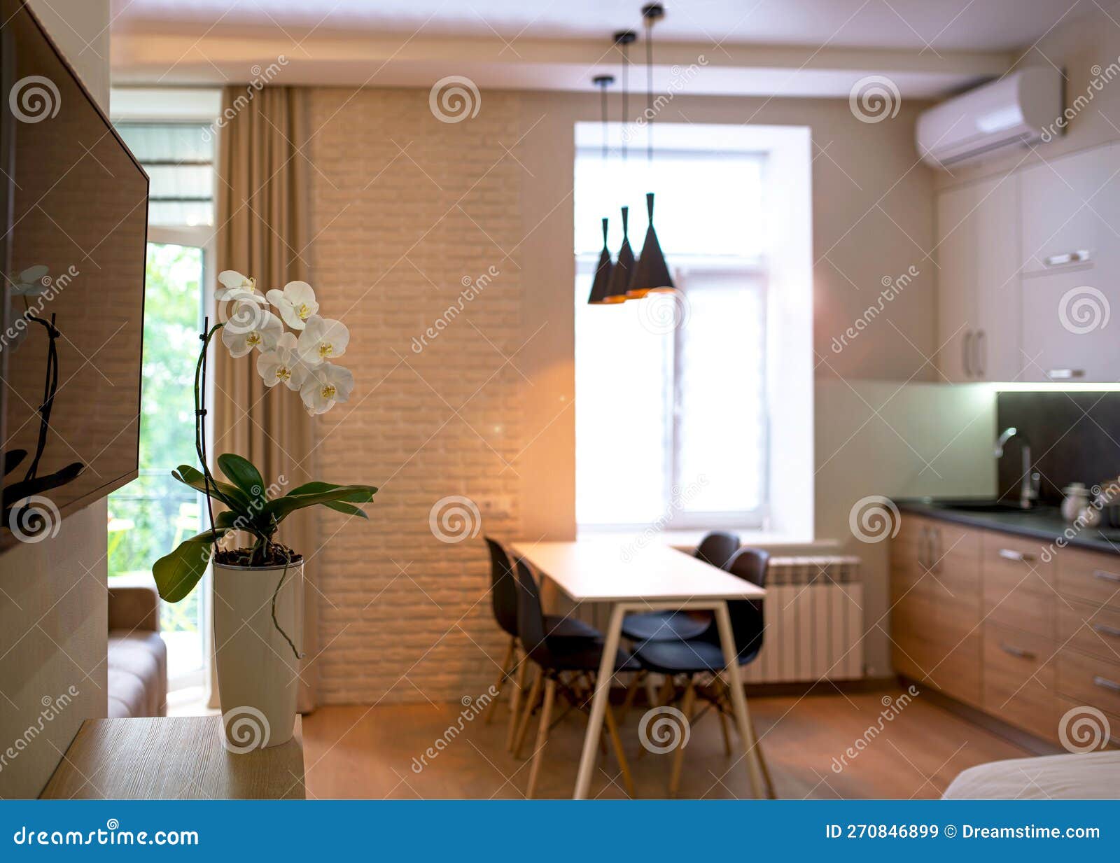 Open Plan Living Room and Kitchen Interior with White Cabinets, Table ...