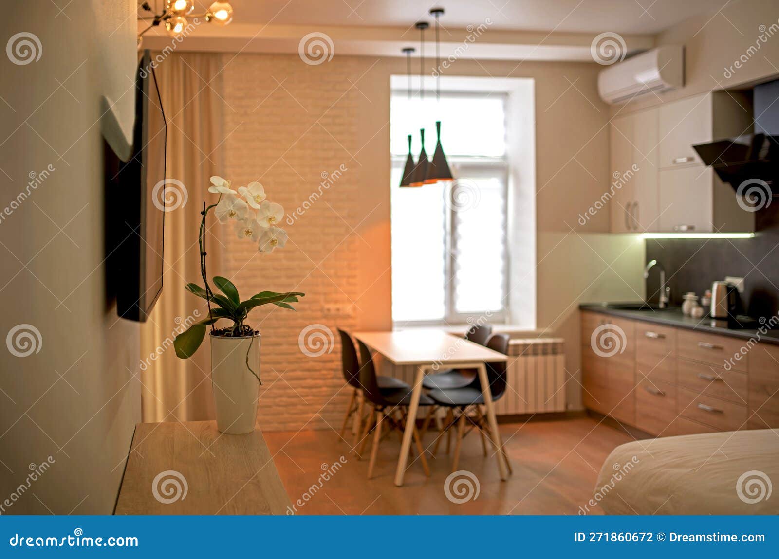 Open Plan Living Room and Kitchen Interior with White Cabinets, Table ...