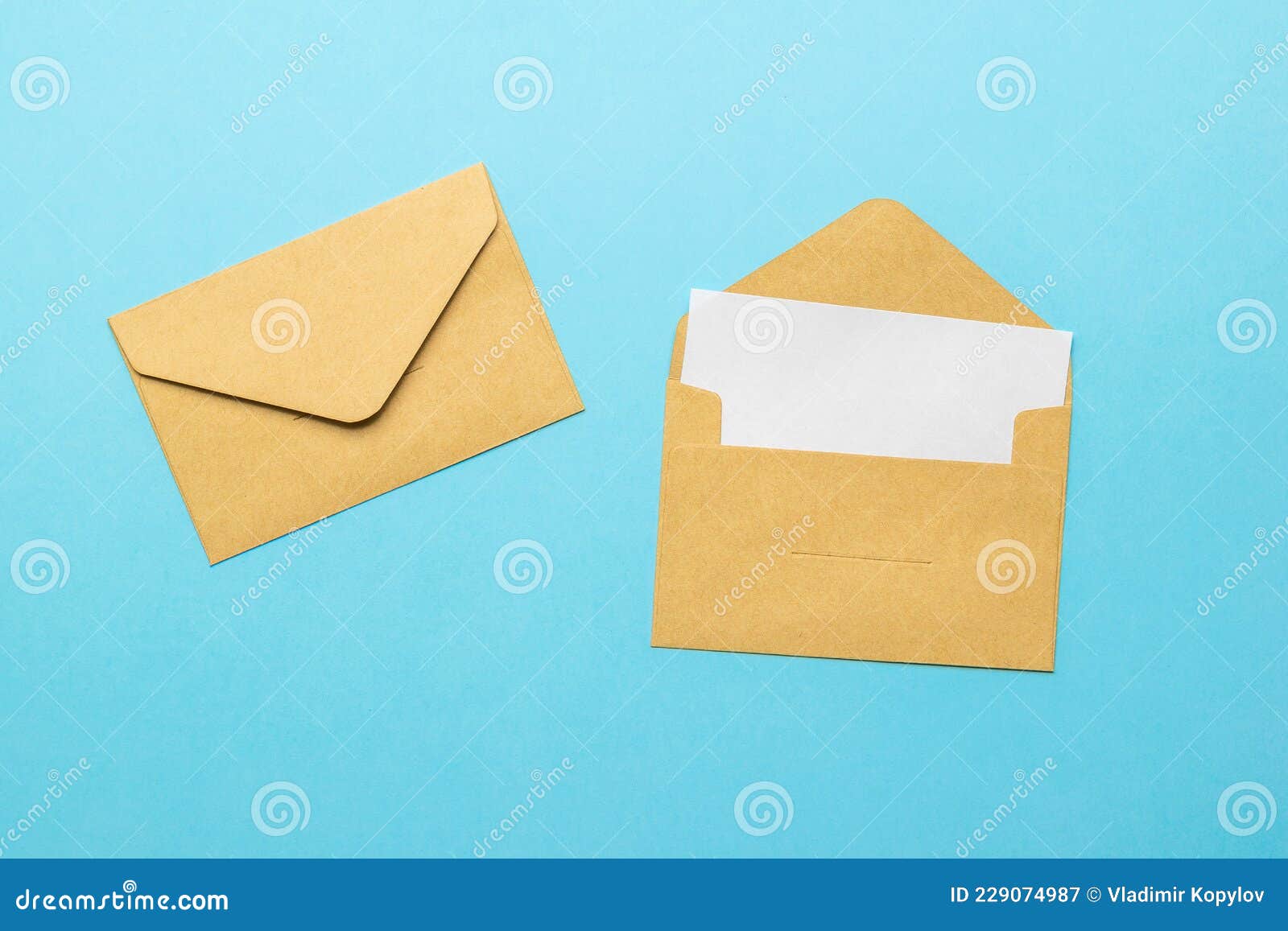 An Open Postal Envelope With An Enclosed White Sheet On A Blue ...