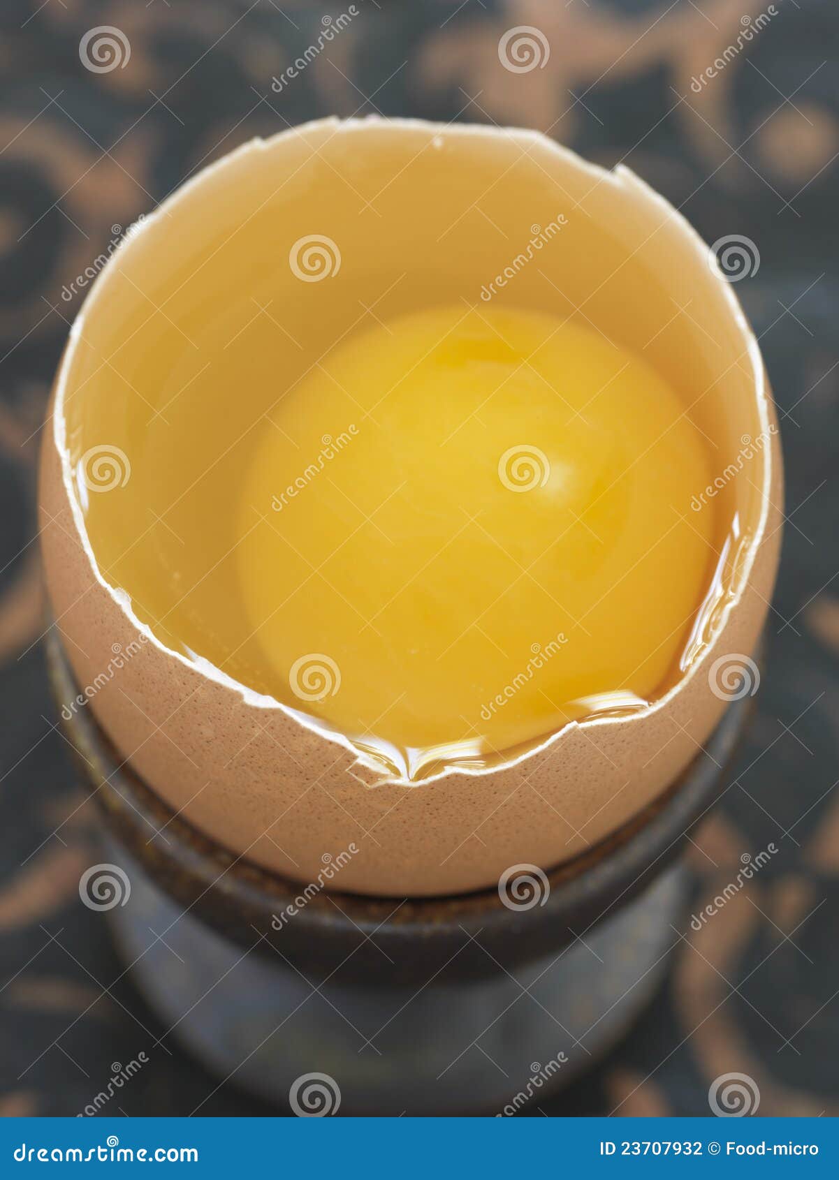 Open raw egg in an eggcup stock photo. Image of classical - 23707932