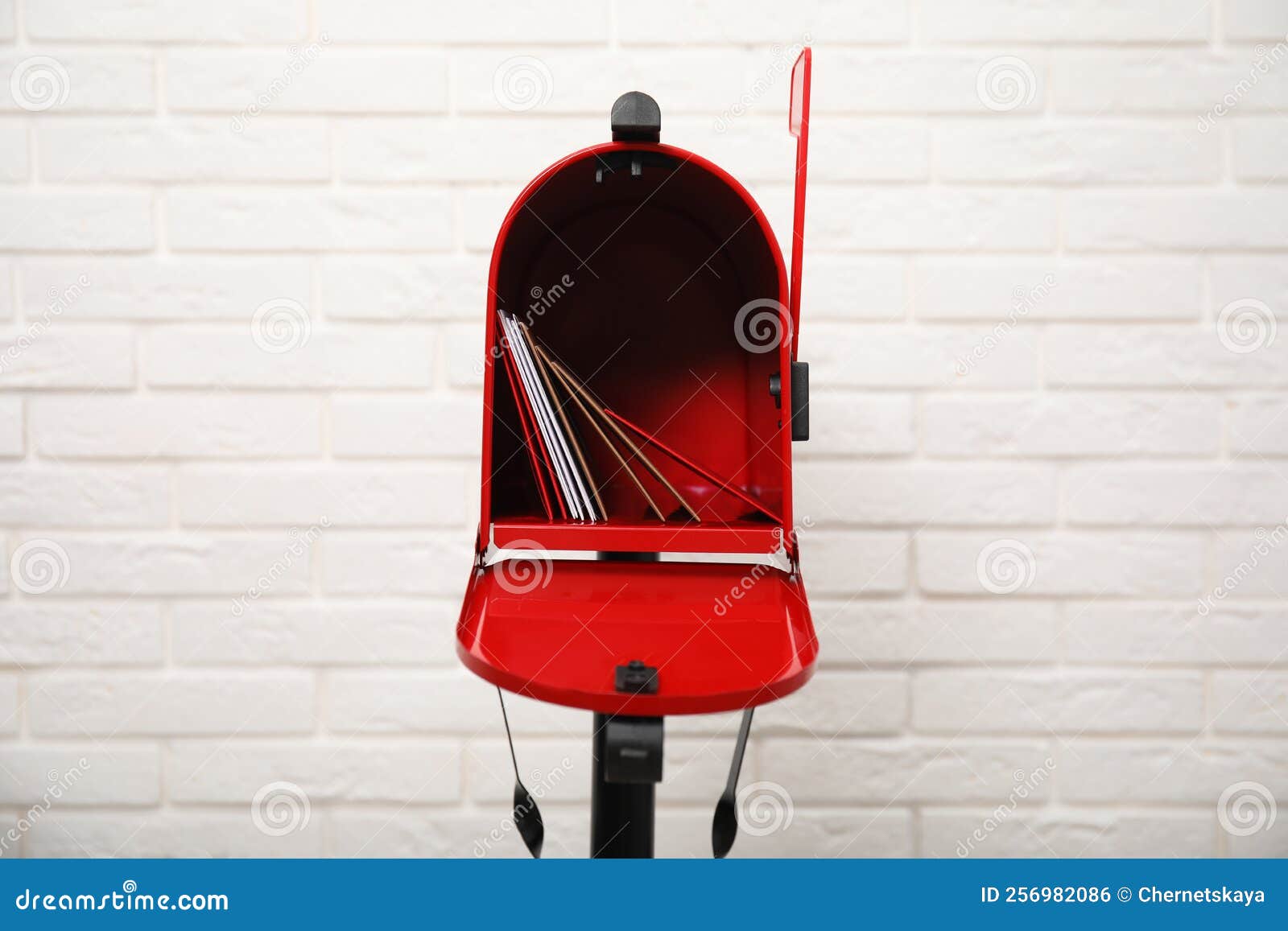 Open Red Letter Box with Envelopes Near White Brick Wall Stock Photo ...