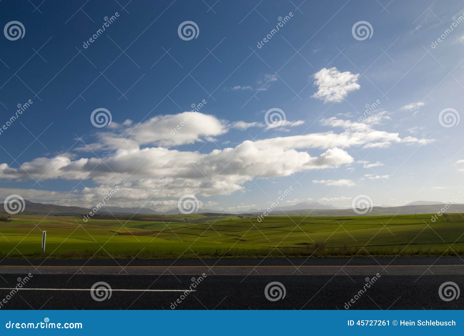 Open road with clouds stock image. Image of grass, hill - 45727261