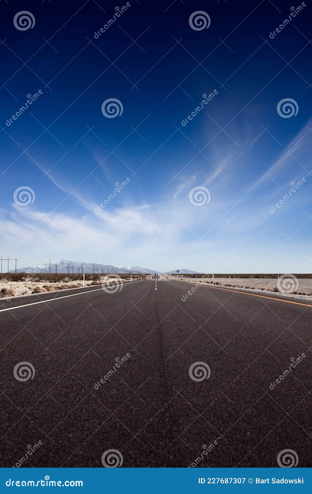 Open Asphalt Road with Long Clouds in the Distance Stock Image - Image ...