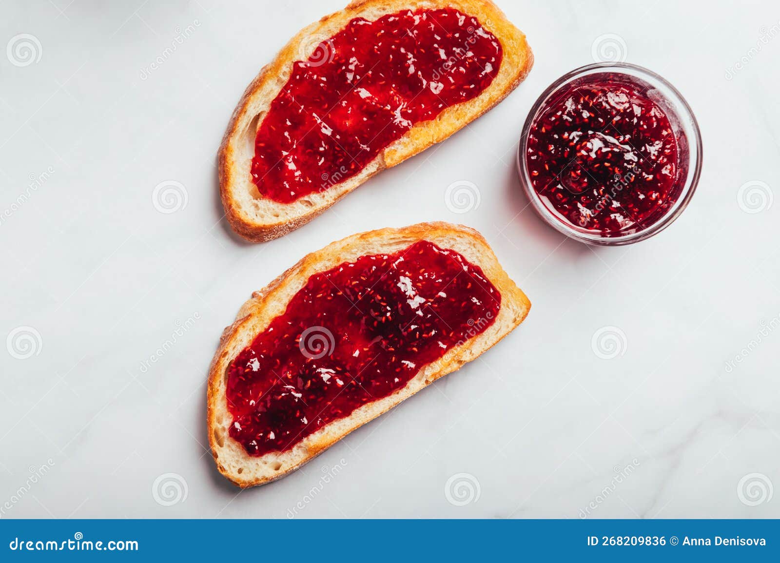 Raspberry jam on toast stock photo. Image of gastronomy - 268209836