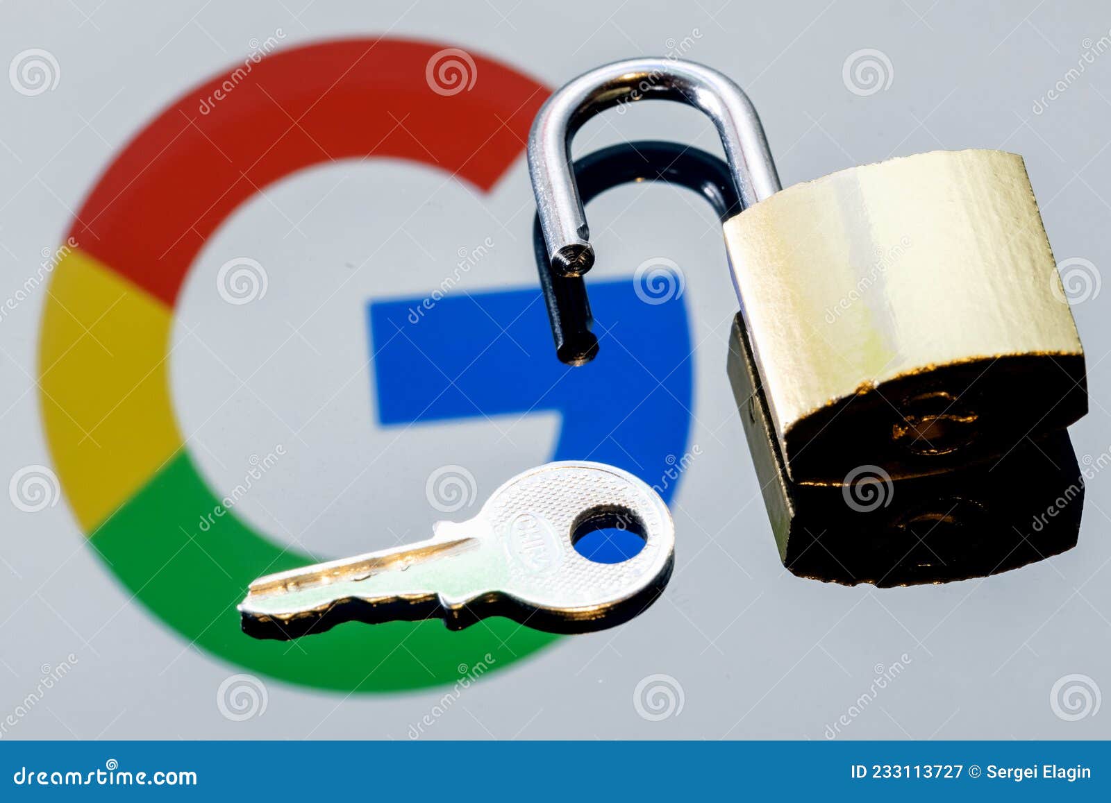 An Open Security Lock and Key on the Background of the Google ...