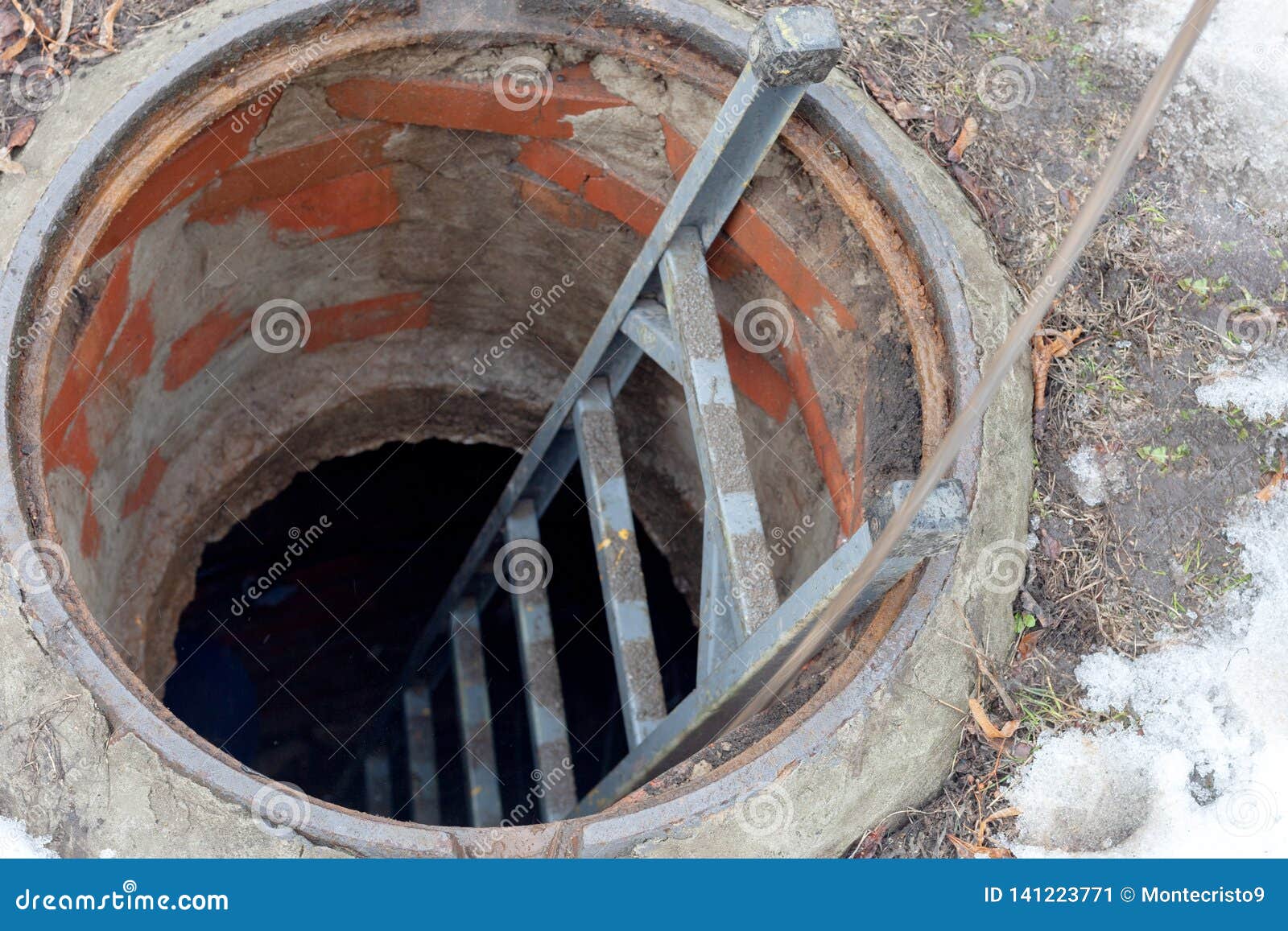 Open Sewer Hatch. Worker Carries Out Work on the Maintenance of ...