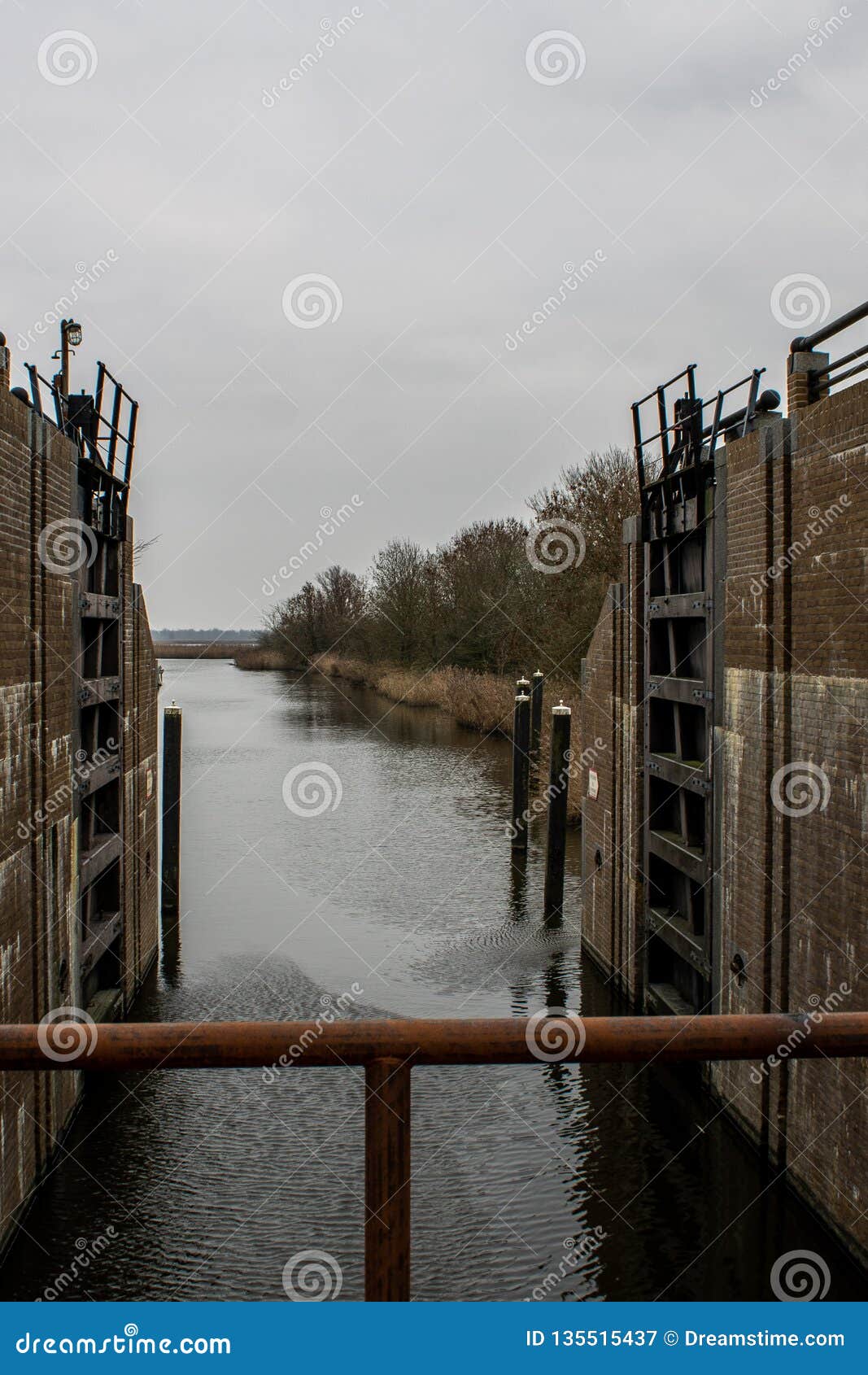 Open sluice in holland stock image. Image of boats, landscape - 135515437