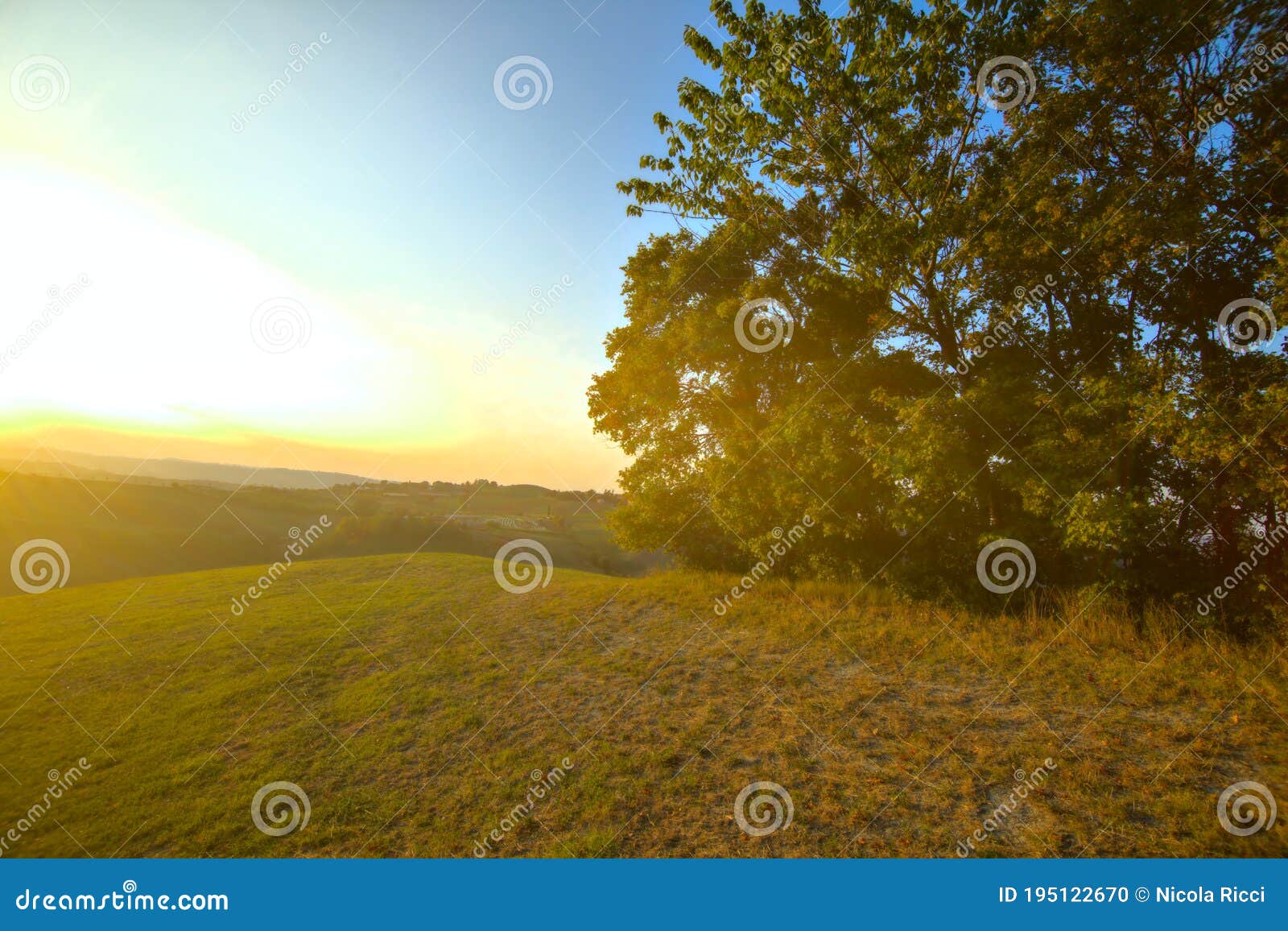 Open Space in a Field on a Hill Slope at Sunset Stock Photo - Image of ...