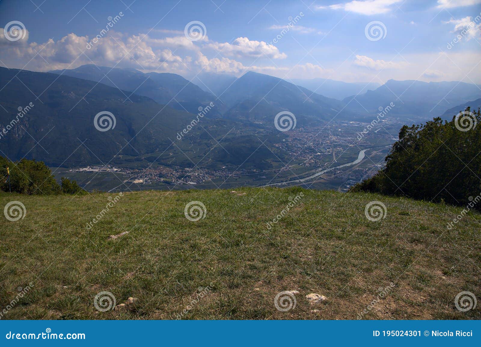 Open Space in the Mountains with Mountain Range and a Town in the ...