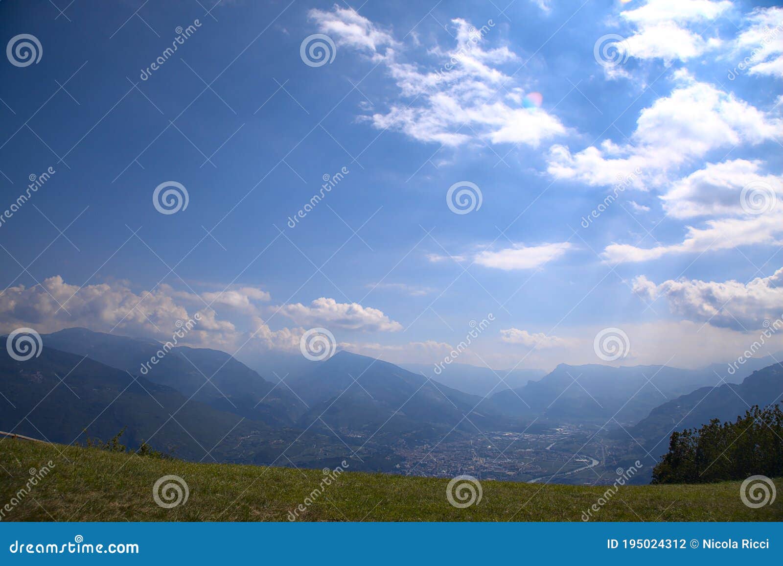 Open Space in the Mountains with Mountain Range and a Town in the ...